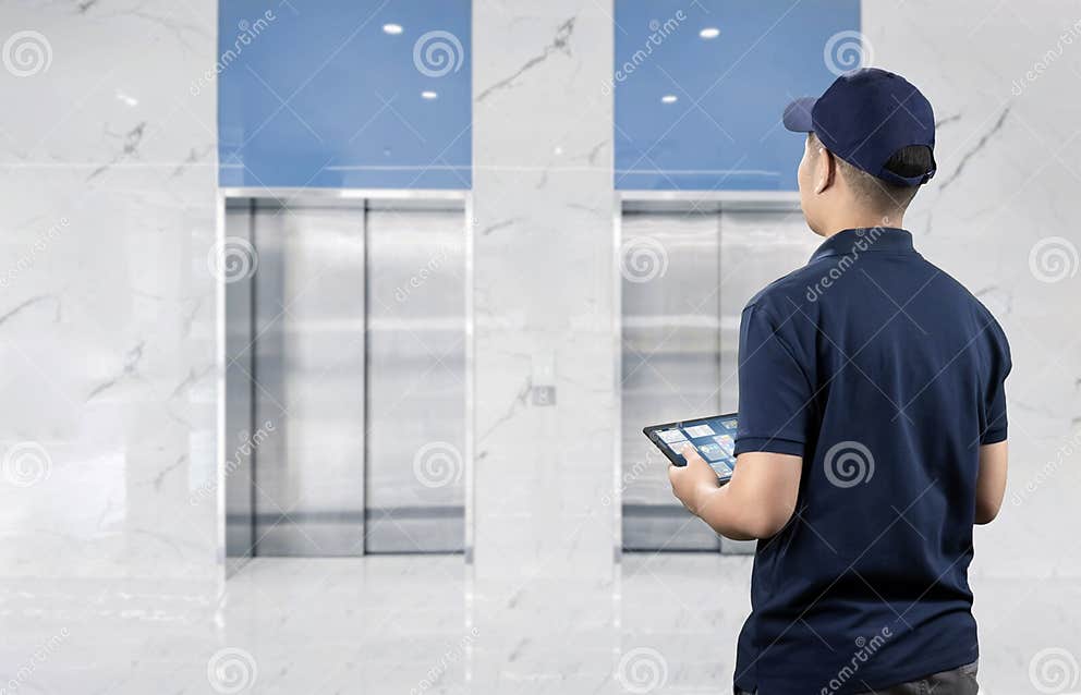 Technician or Engineer Check on Elevator or Passenger Lift Stock Photo ...