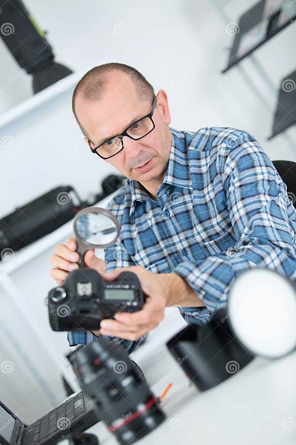 Technician Engineer Checking Dslr Sensor with Magnifying Glass Stock ...