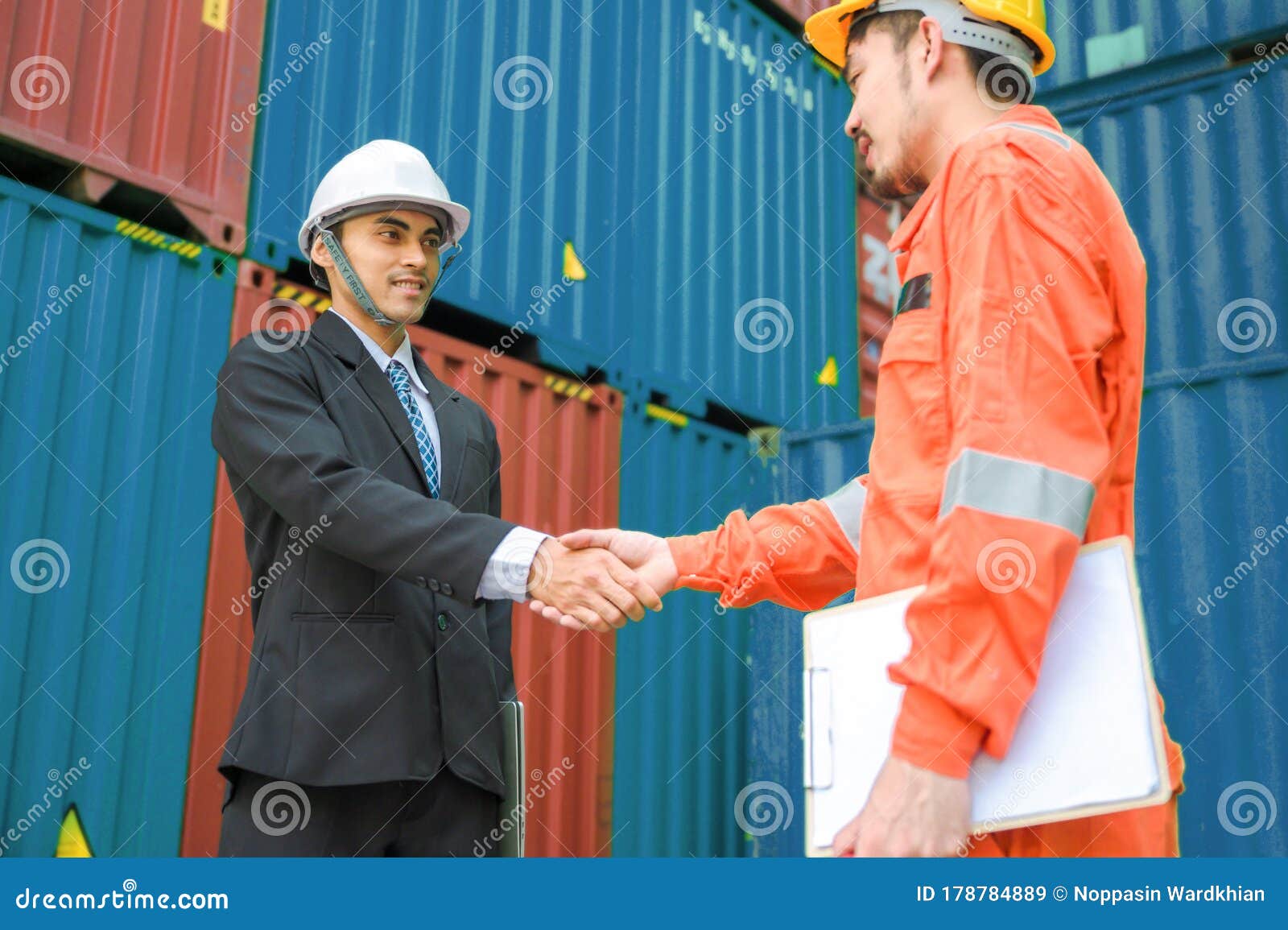 Technician and Engineer Shake Hand in Cargo Container Area with Concept ...
