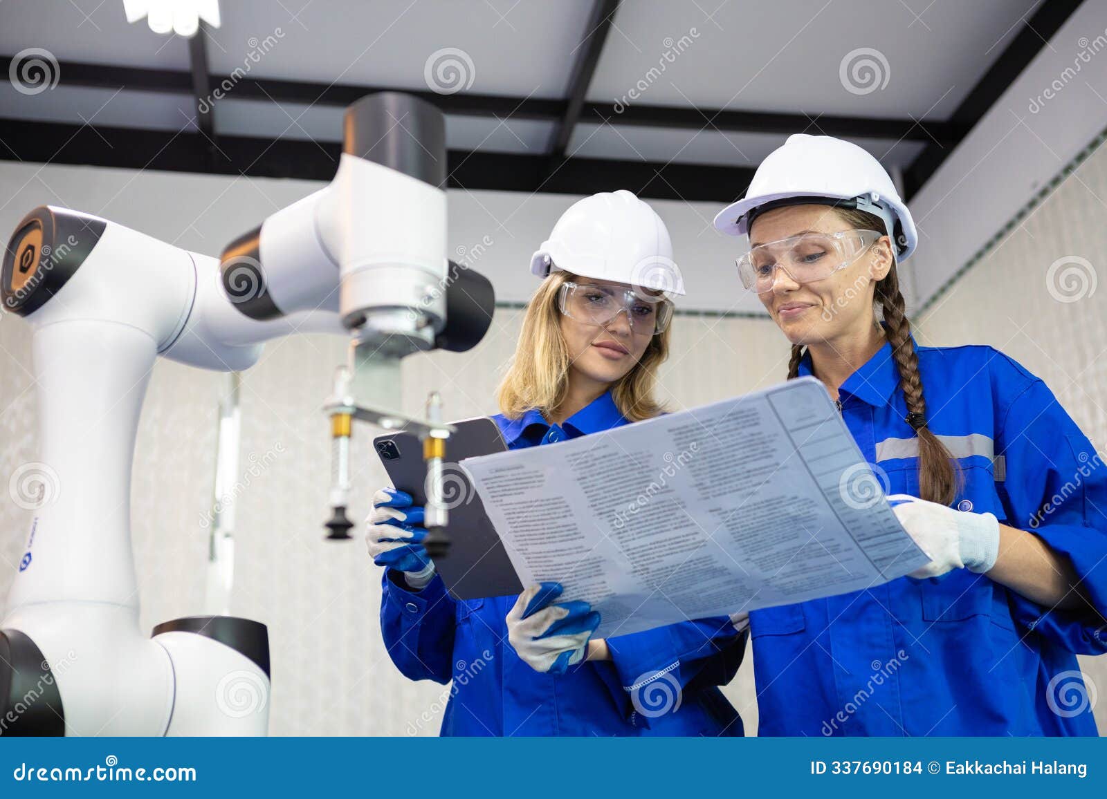 Technician Engineer Using Remote Control Automation Robotics at ...