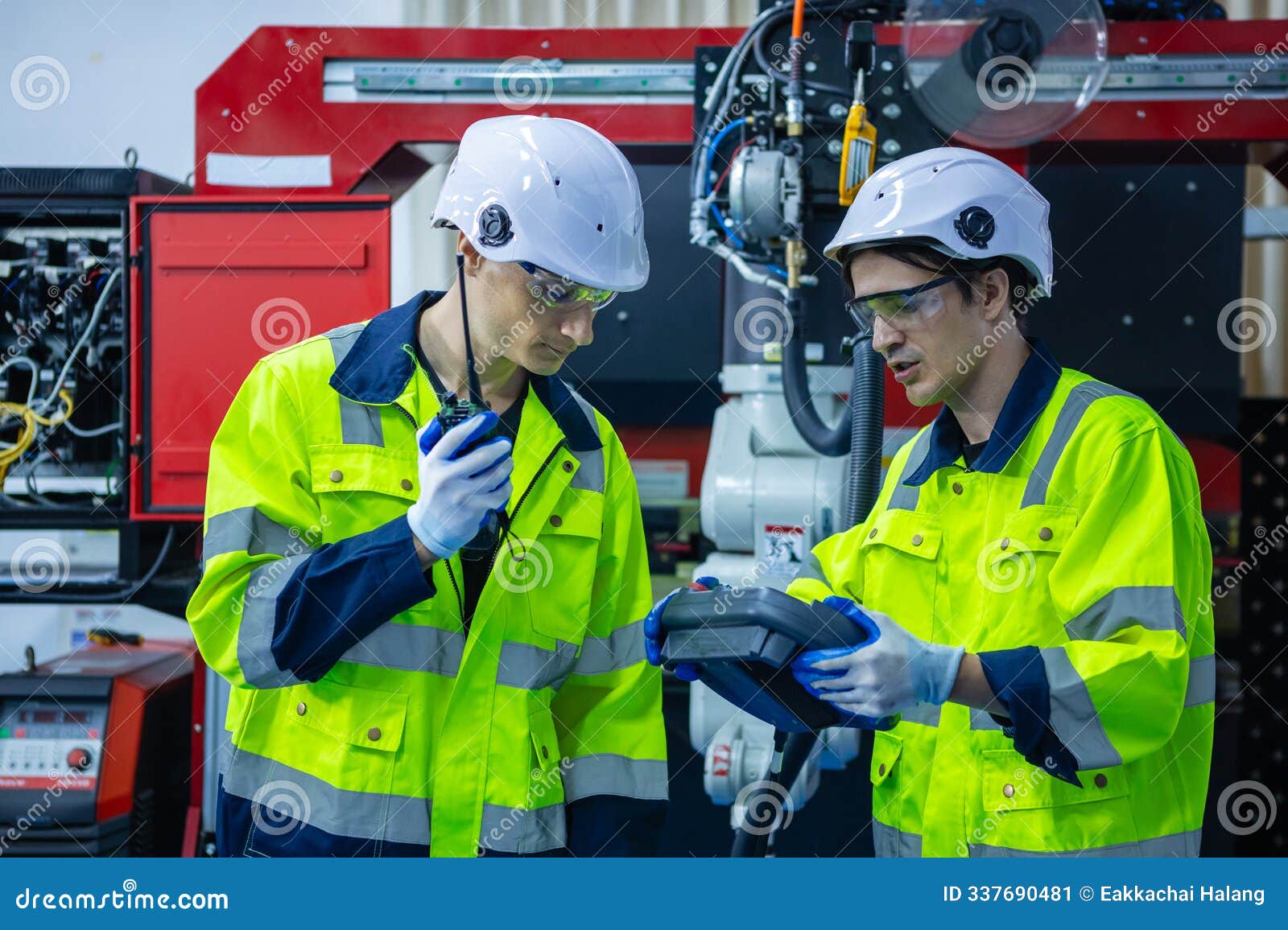Technician Engineer Using Remote Control Automation Robotics at ...