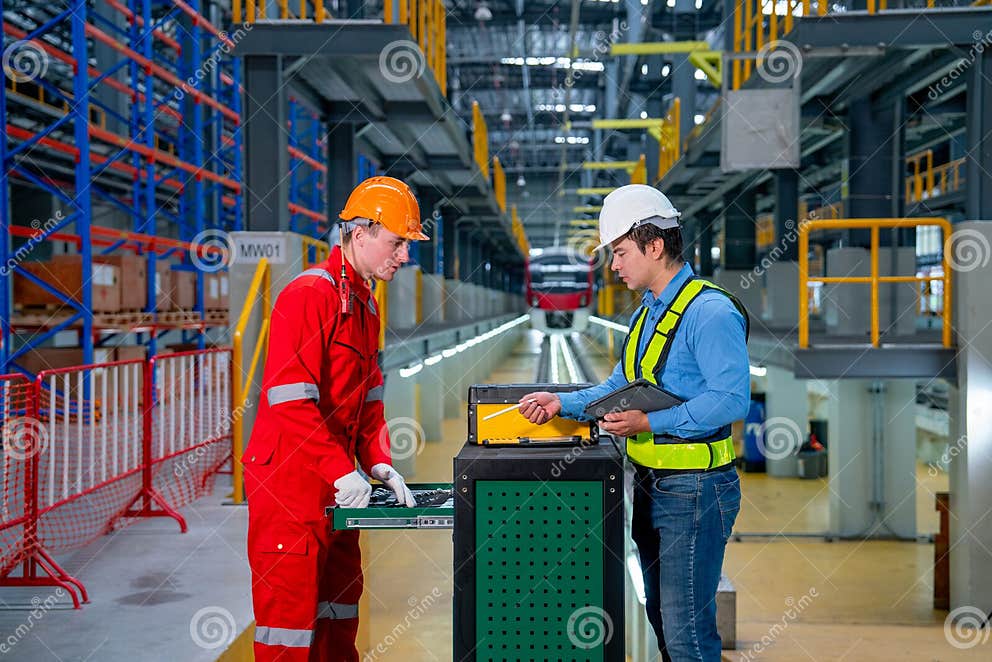 Technician and Engineer Worker Discuss about Tools and Equipment with ...