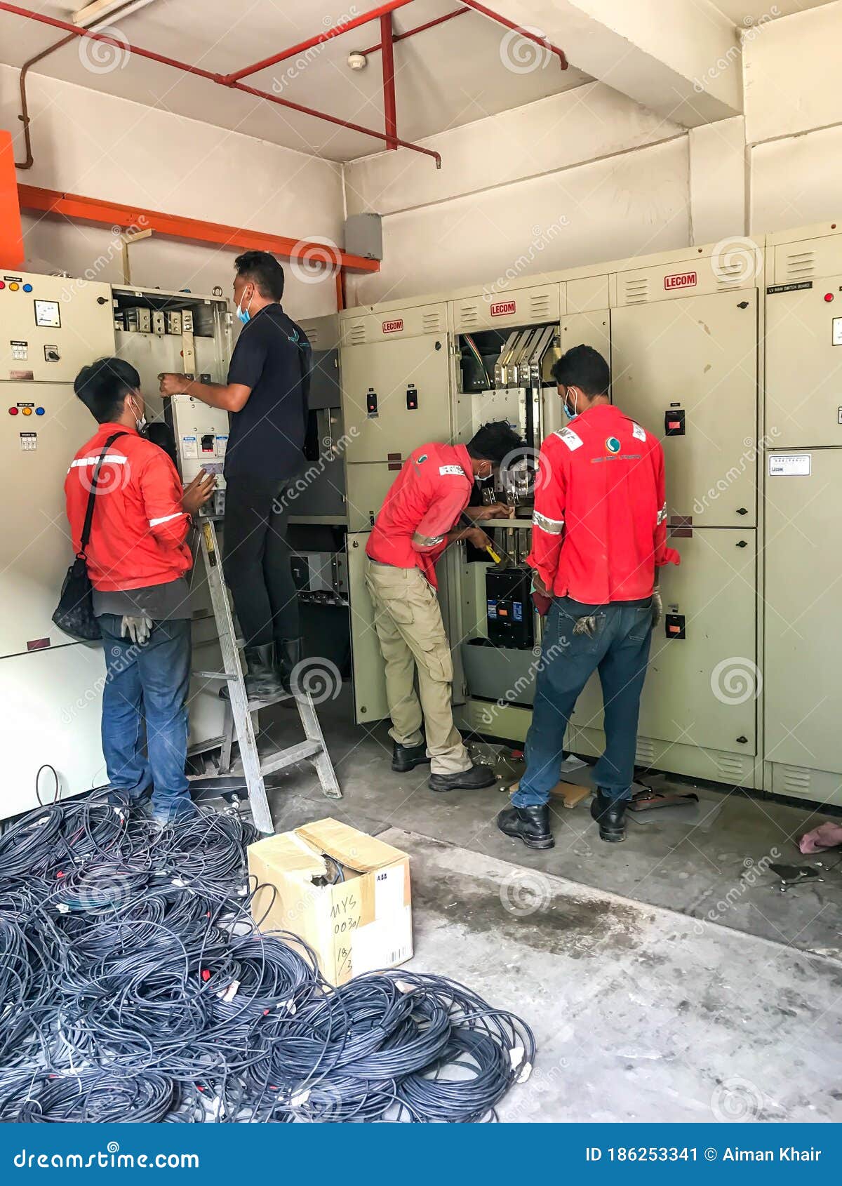 Technician and Engineer Working on Maintenance at Main Switchboard MSB ...