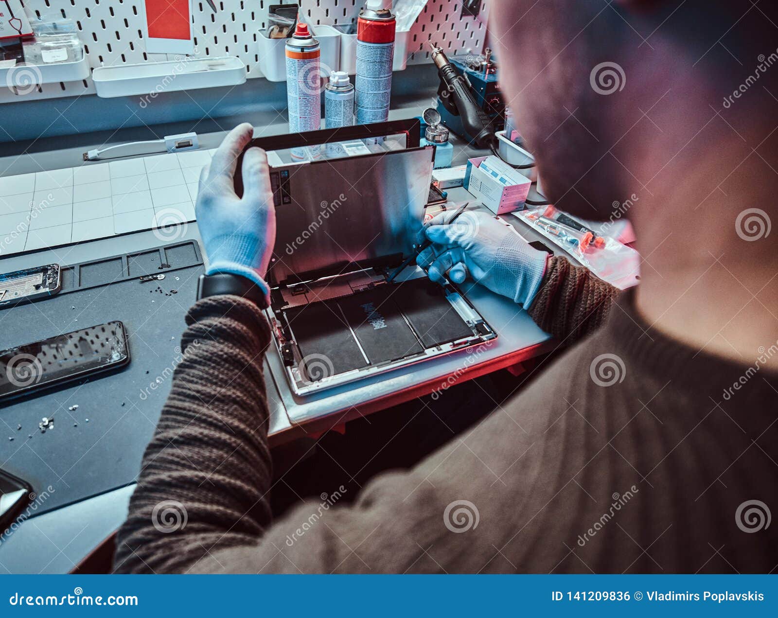 A Broken Tablet With A Swollen Battery And A Dirty Screen And A Bare ...