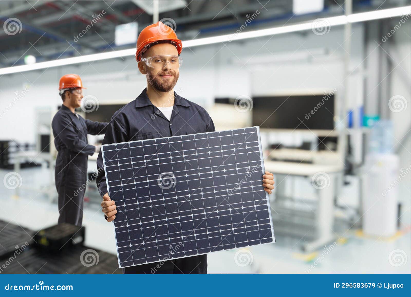 Technician at a Facotry Holding a Solar Panel Stock Image - Image of ...