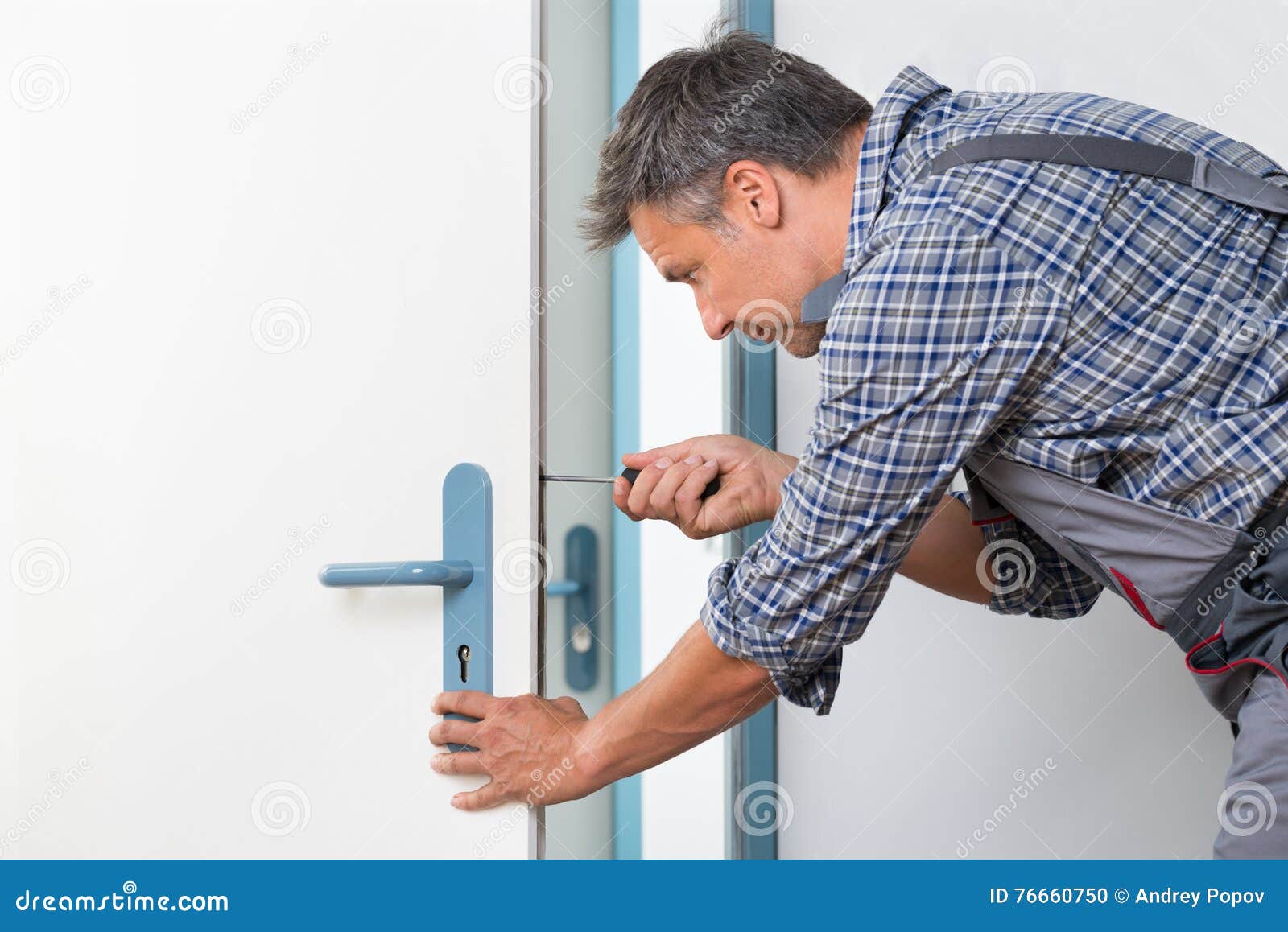 Technician Fixing Lock in Door with Screwdriver Stock Photo - Image of ...