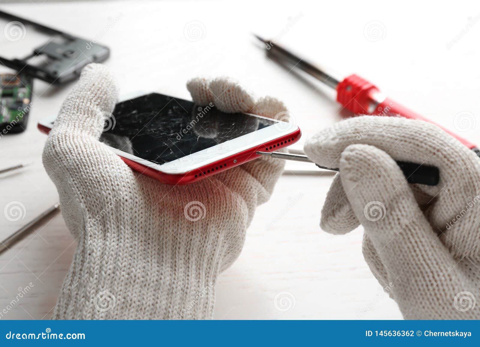 Technician Fixing Mobile Phone at Table. Device Repair Service Stock ...