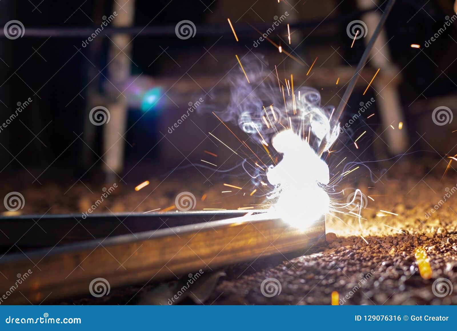 Technician Focus on Welding Process on Spark Light with Equipment ...
