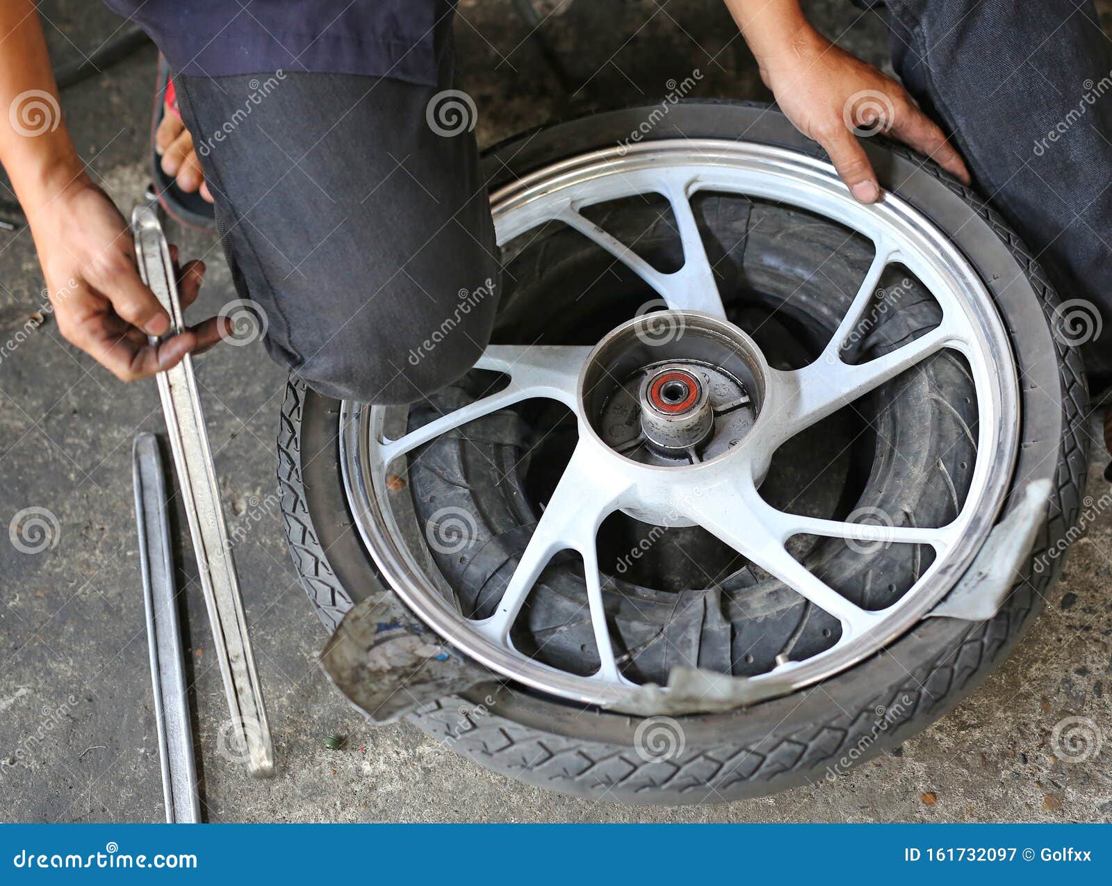 Technician Hand Fixing Wheel the Motorcycle Stock Image - Image of ...