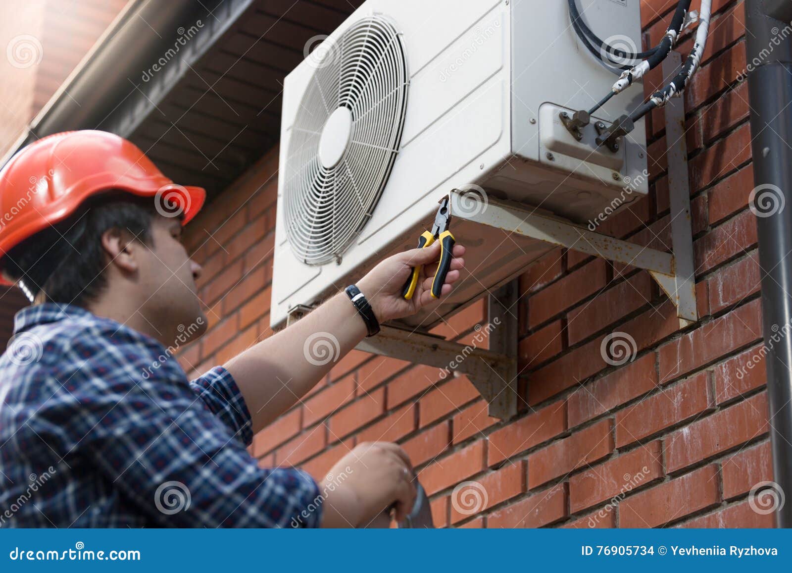 Technician in Hardhat Connecting Outdoor Air Conditioning Unit Stock ...