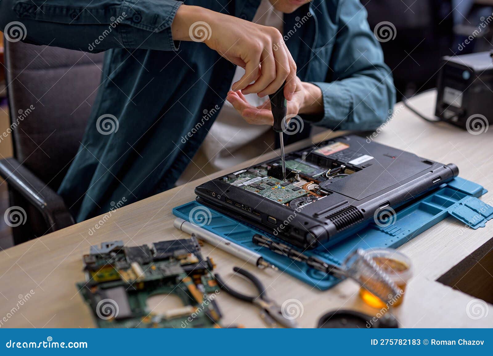 Technician Hold the Screwdriver for Repairing the Laptop. Computer ...