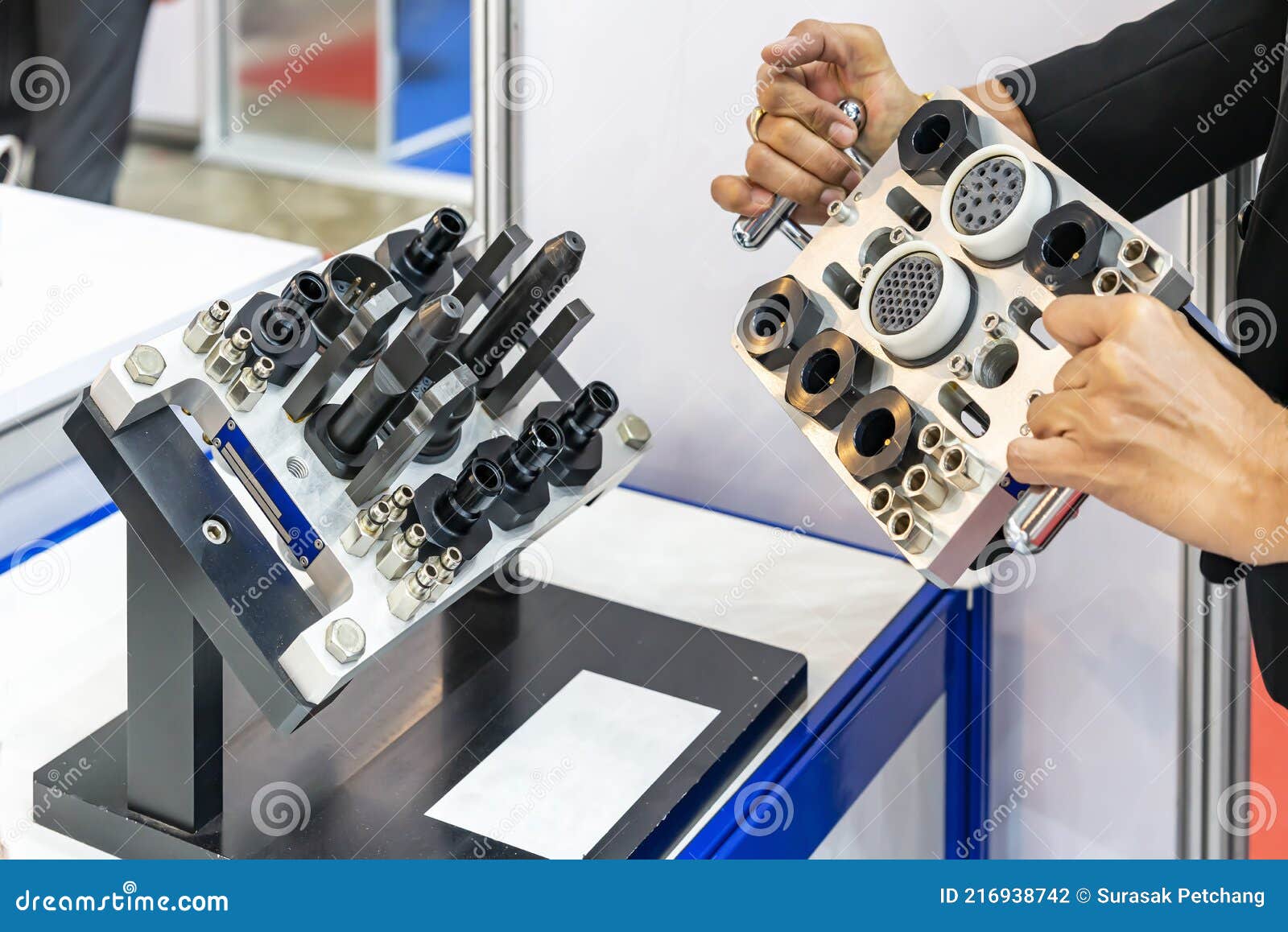 Technician Holding Assistance Mounting of Multi Coupling with ...