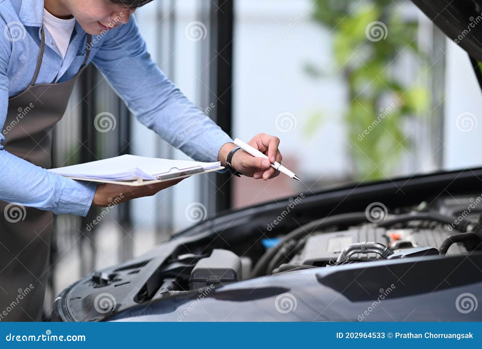 A Technician is Holding Clipboard Doing the Checklist for Repair ...