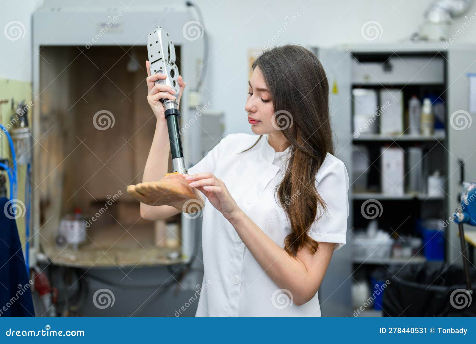 Technician Holding Prosthetic Leg Checking and Working in Laboratory ...
