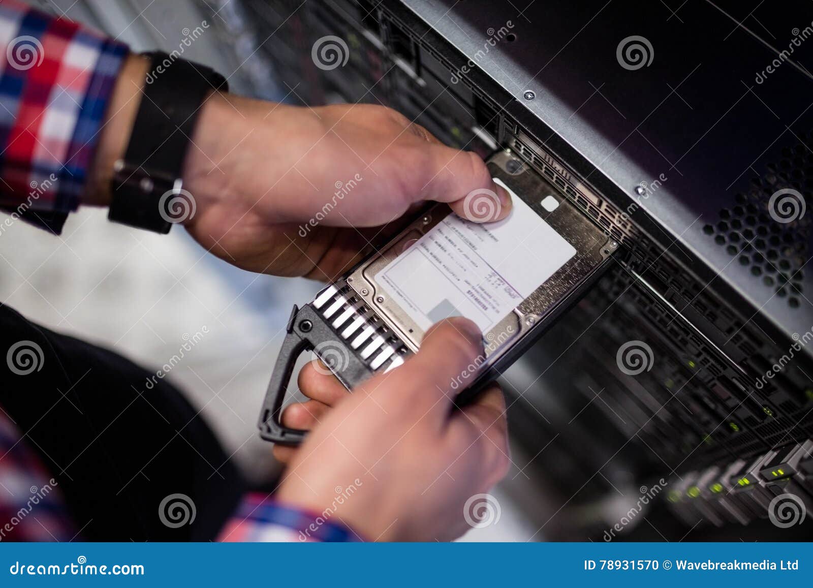 Technician Inserting a Hard Disk Drive into a Blade Server Stock Photo ...