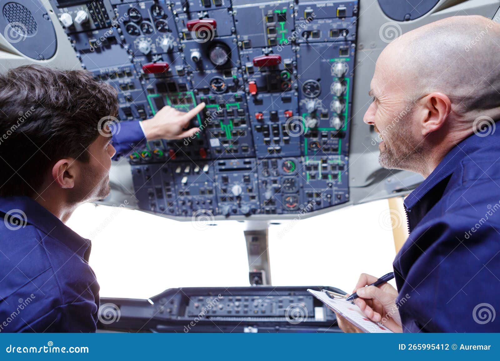 Technician Inspecting Cockpit Panel Stock Photo - Image of business ...