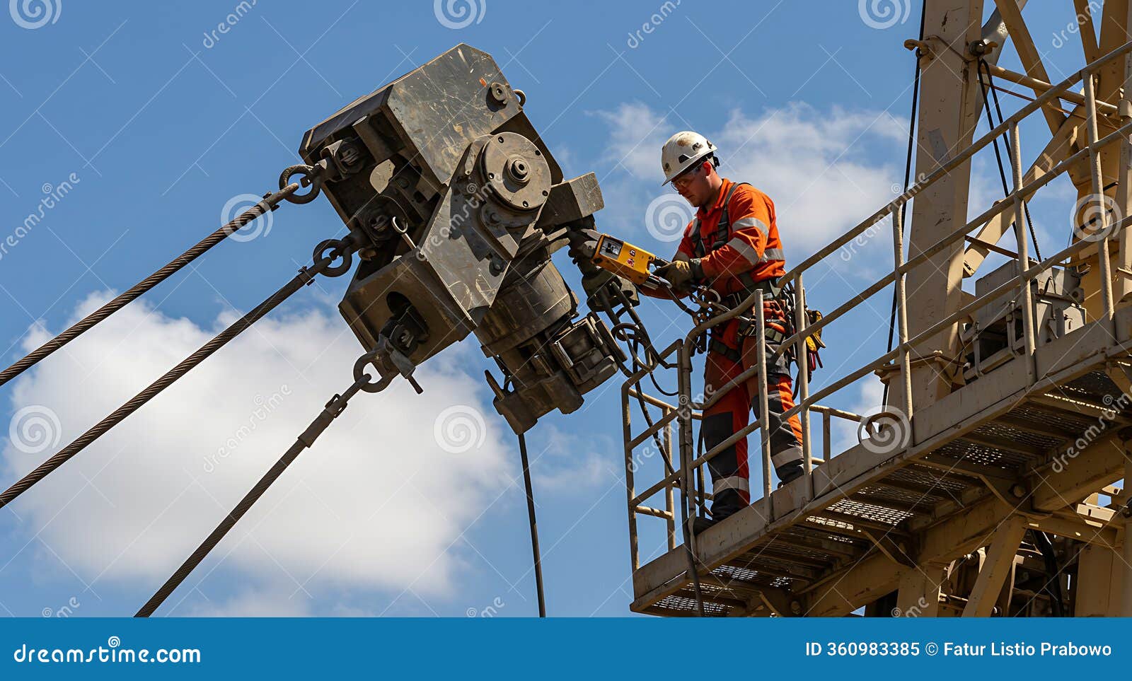 Technician Inspecting Heavy Lifting Equipment with Control Panel on ...