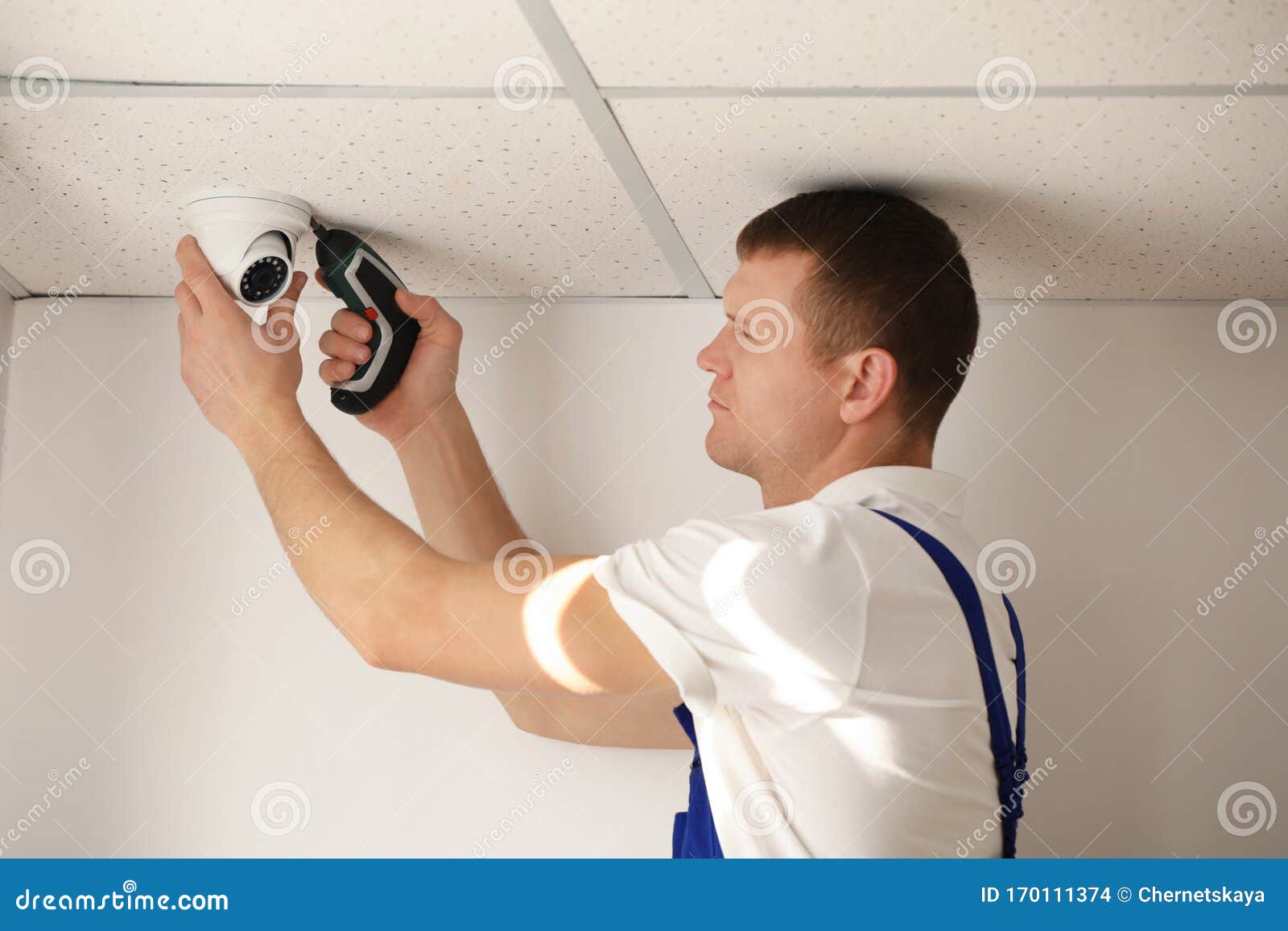 Technician Installing CCTV Camera on Ceiling Stock Photo - Image of ...