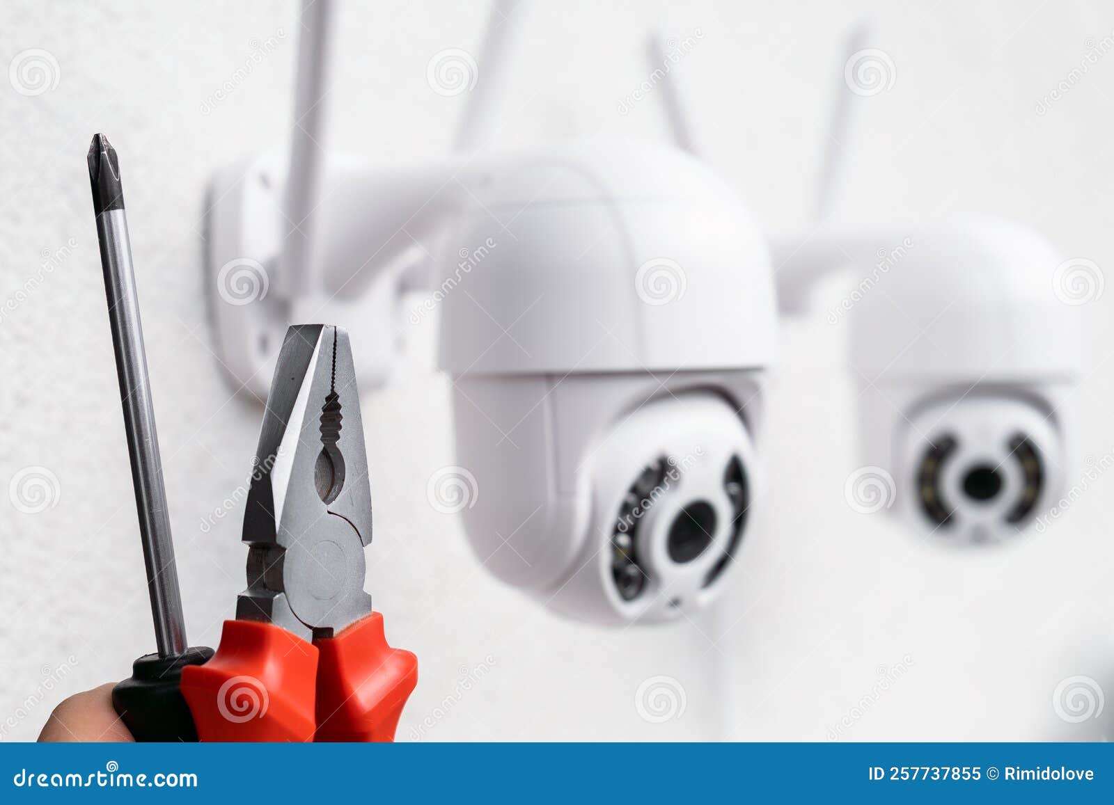 Technician Installing CCTV Camera Using Pliers and Screwdriver Stock ...
