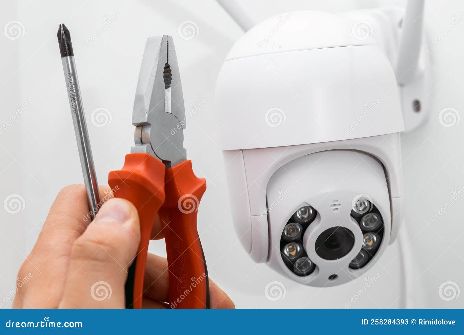 Technician Installing CCTV Camera Using Pliers and Screwdriver Stock ...