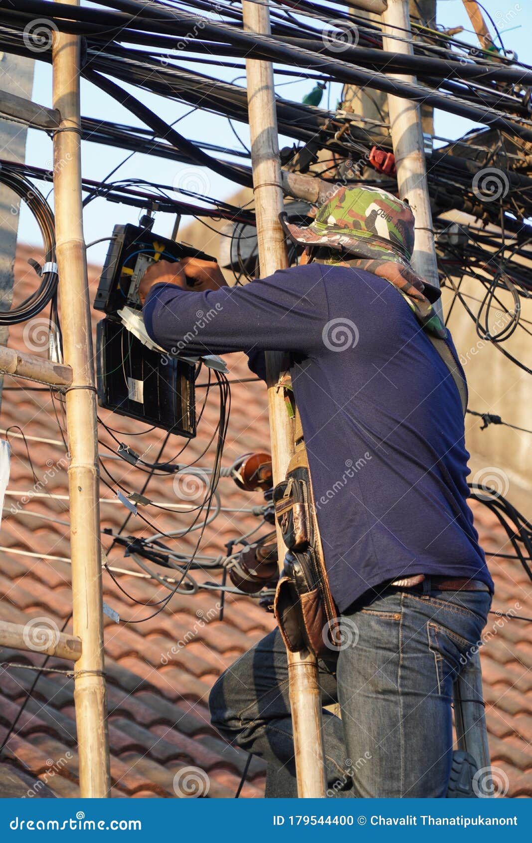 The Technician is Installing Fiber Optic for Internet Network Stock ...