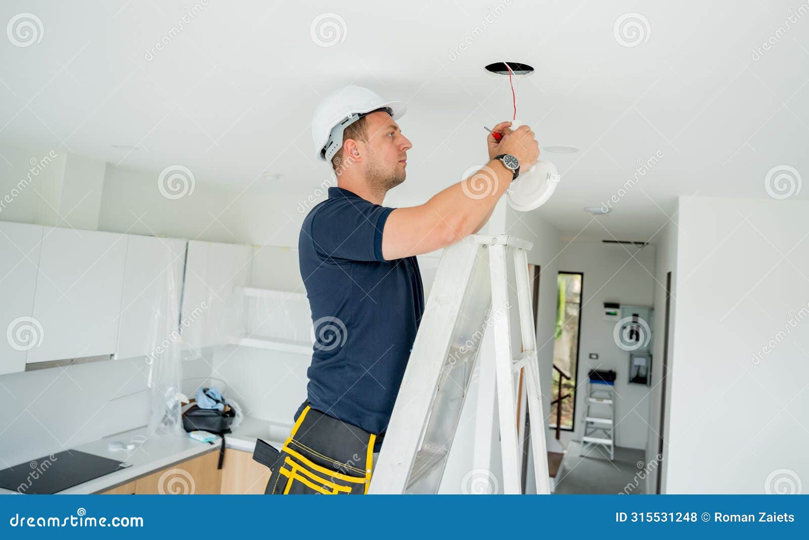 Technician is Installing an LED Spotlight in the Ceiling. Stock Photo - Image of modern ...