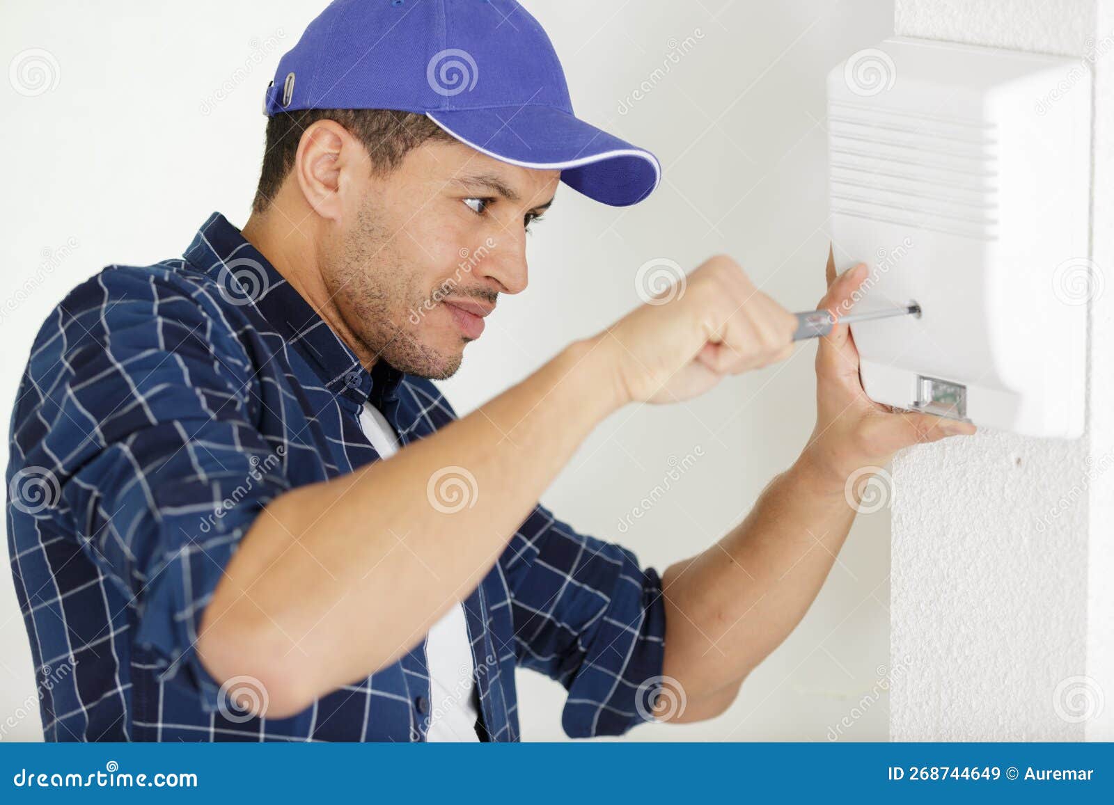 Technician Installing Security System Door Sensor Using Screwdriver ...