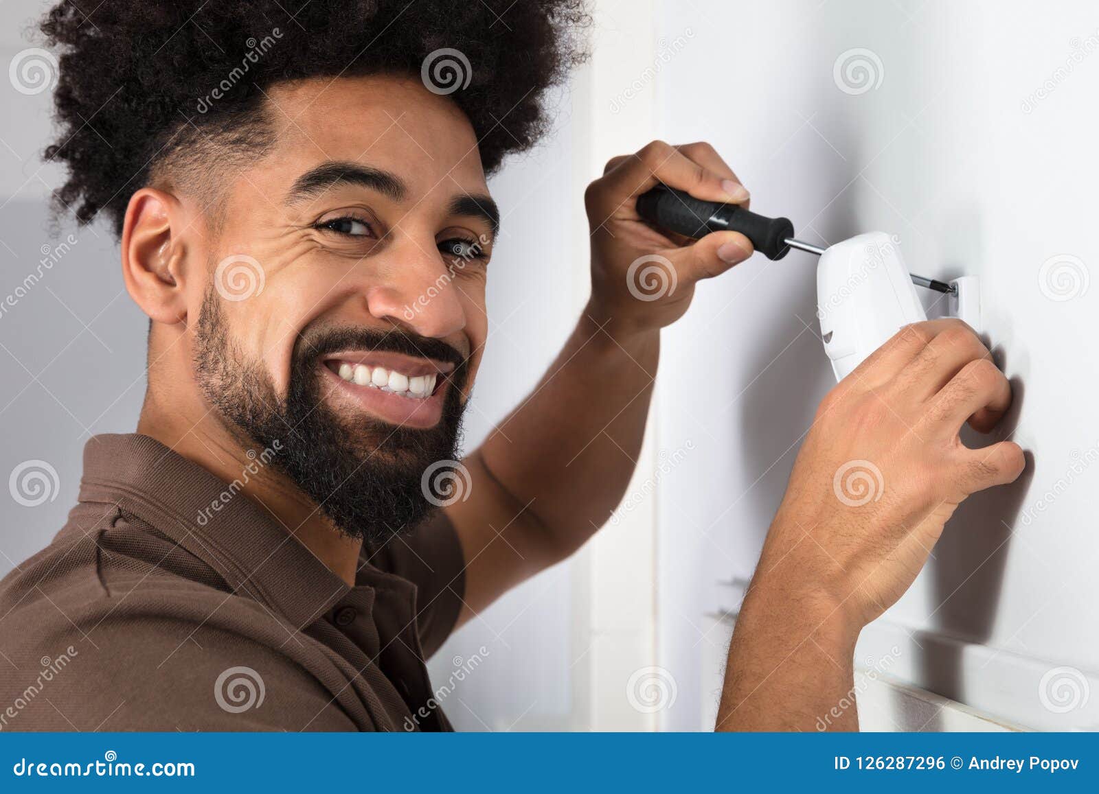 Technician Installing Security System Motion Sensor Stock Photo - Image ... Technician Installing Security System Motion Sensor Stock Photo - Image ...