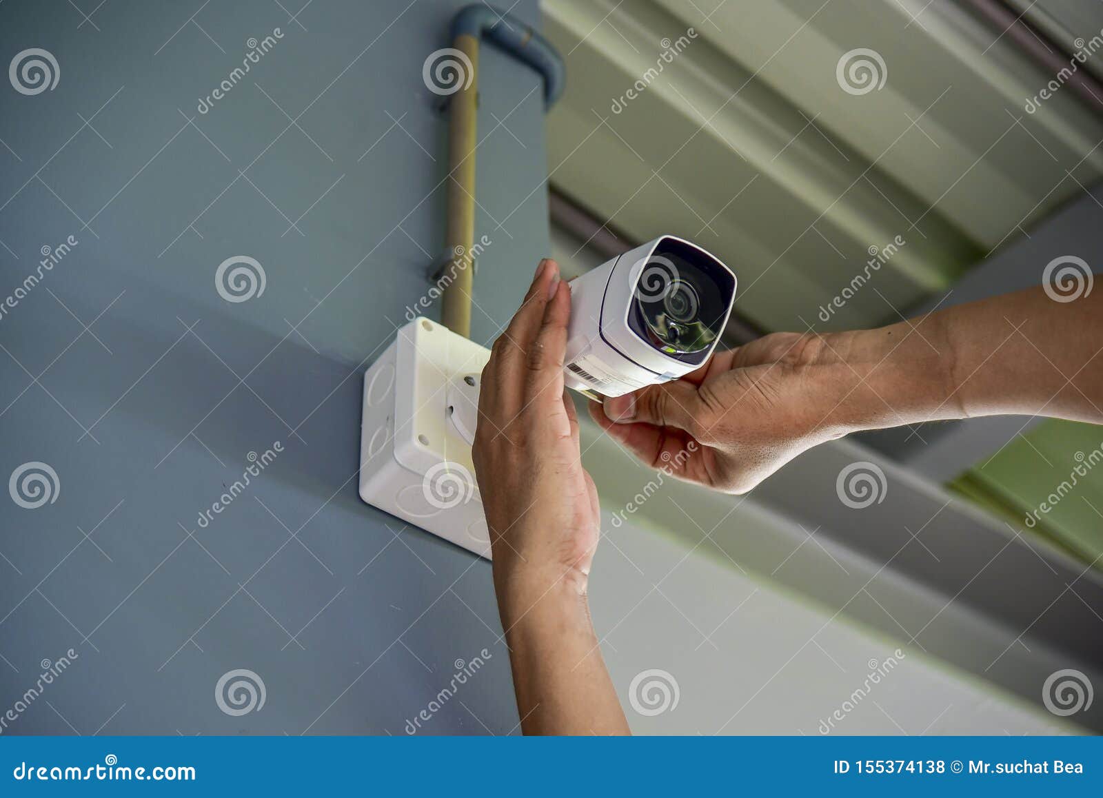 Technician Installing Wireless CCTV Camera by Screwed for Home Security ...