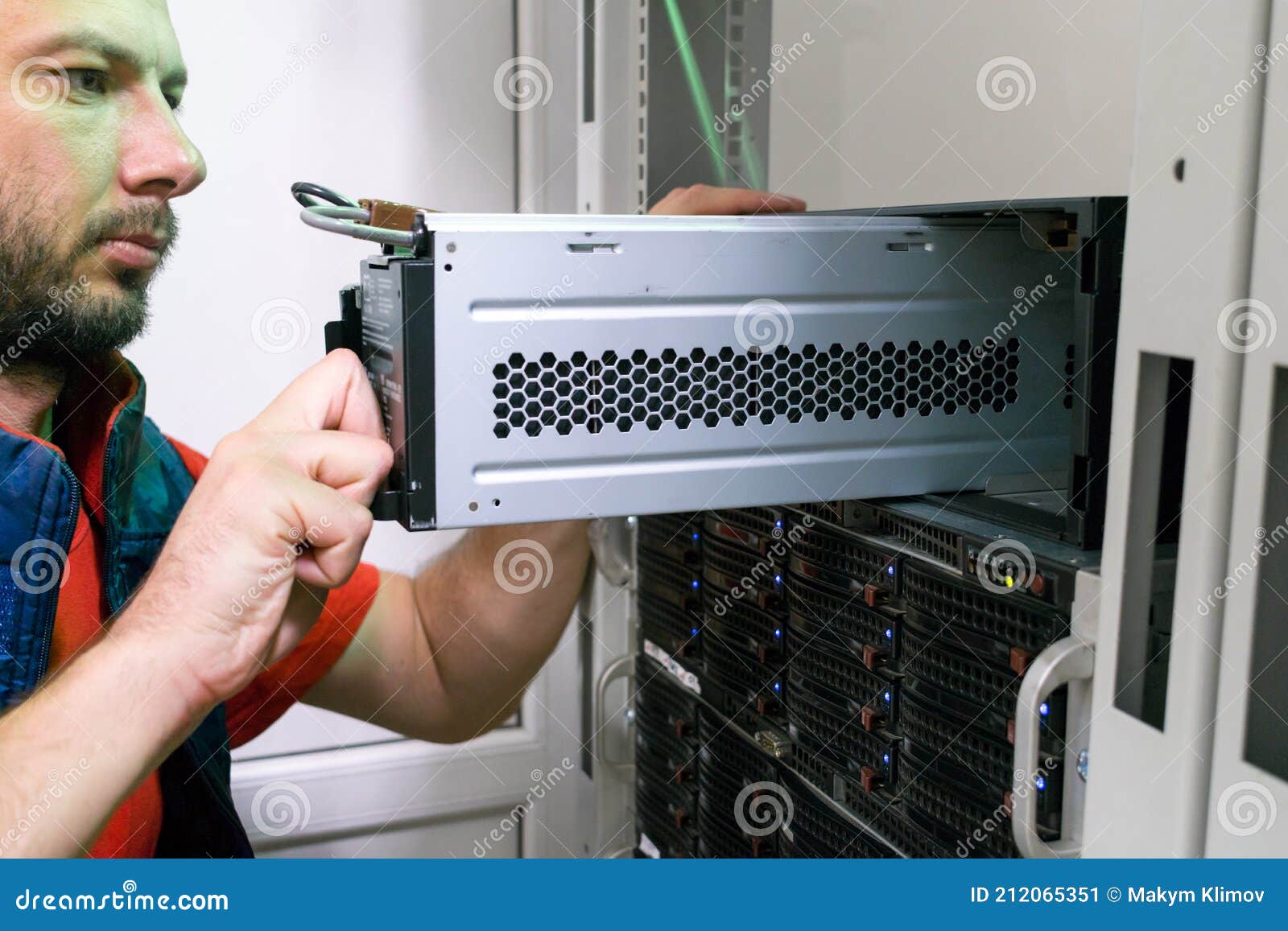 The Technician Installs a New Battery Pack into the Uninterruptible ...