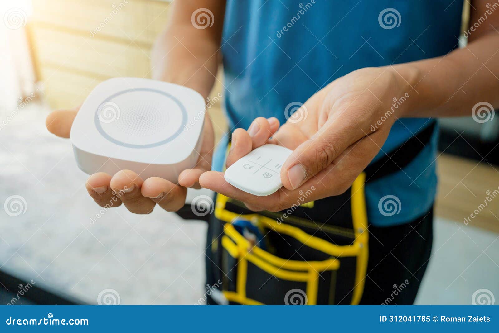 A Technician Installs a Security Alarm Siren in a Modern Apartment ...