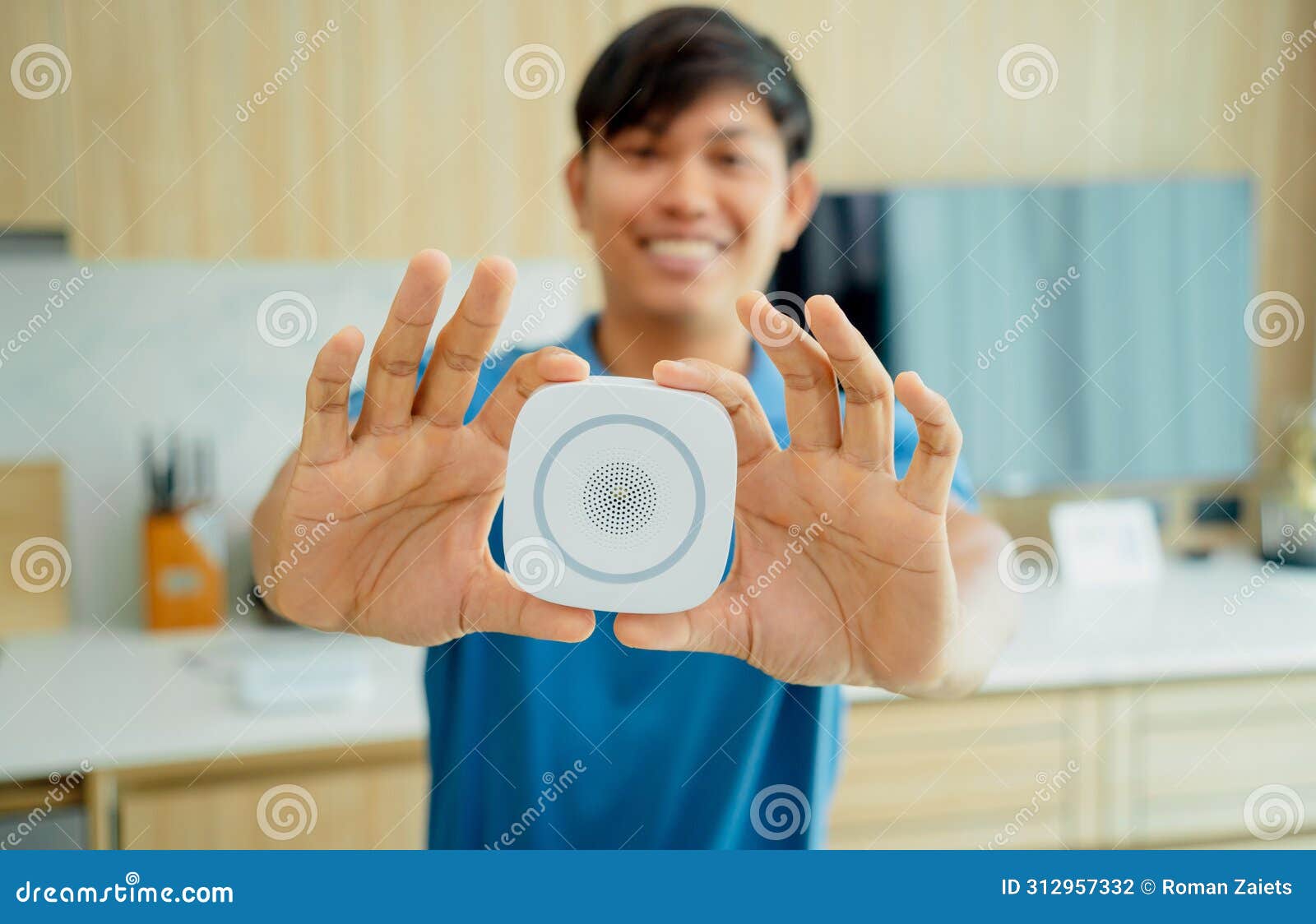 A Technician Installs a Security Alarm Siren in a Modern Apartment ...