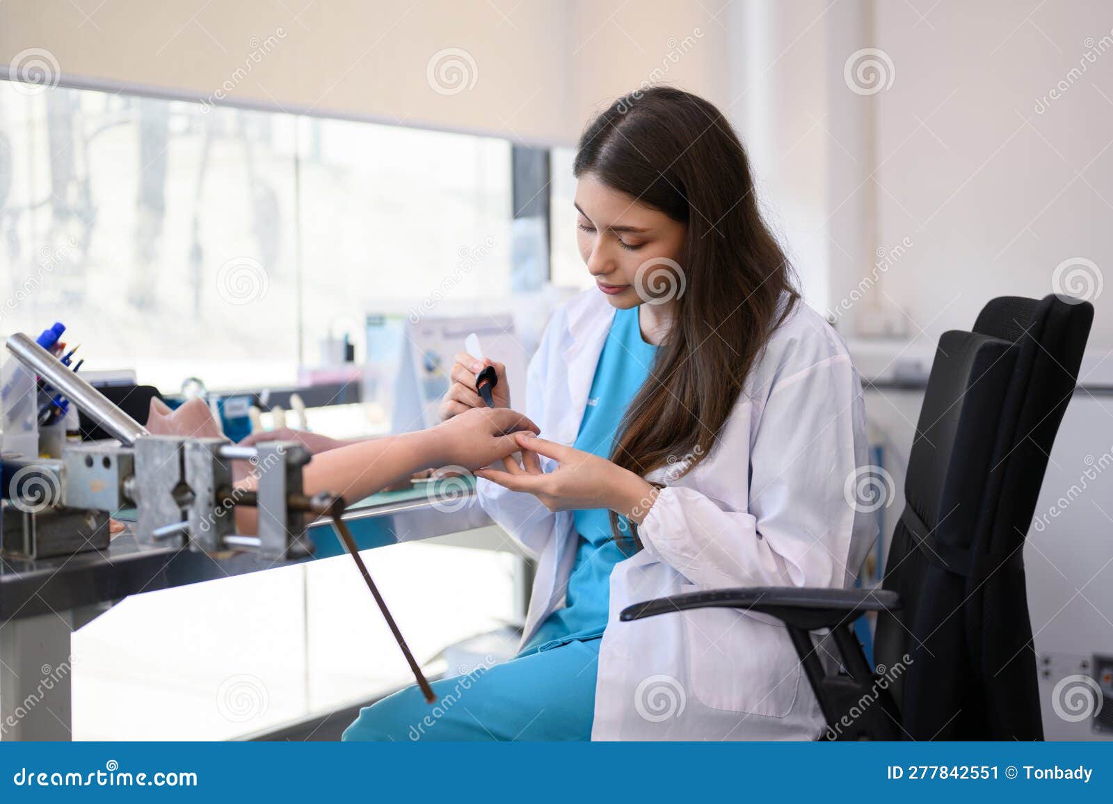 Technician Making Prosthetic Device Using Grinder To Smooth Socket ...