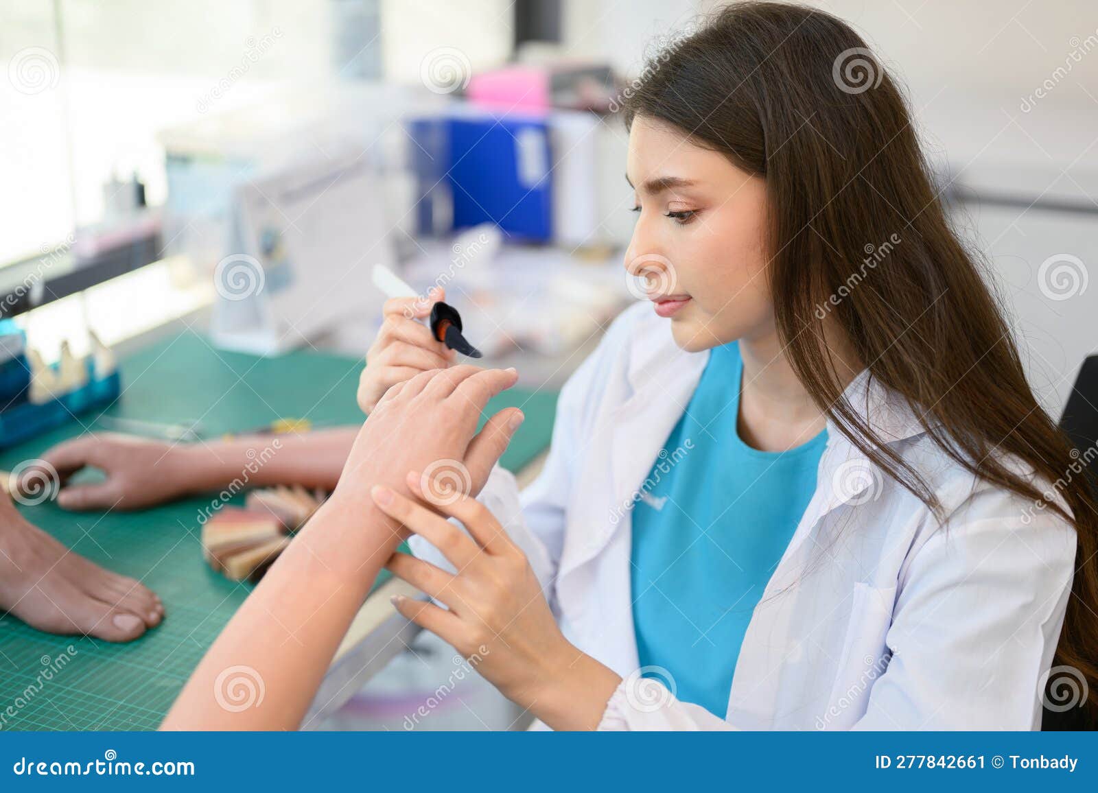 Technician Making Prosthetic Device Using Grinder To Smooth Socket ...