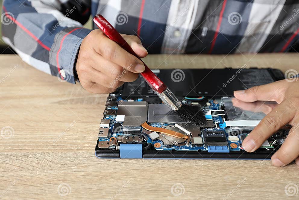 Technician Man Using a Dusting Brush To Clean Laptop Computer Stock ...