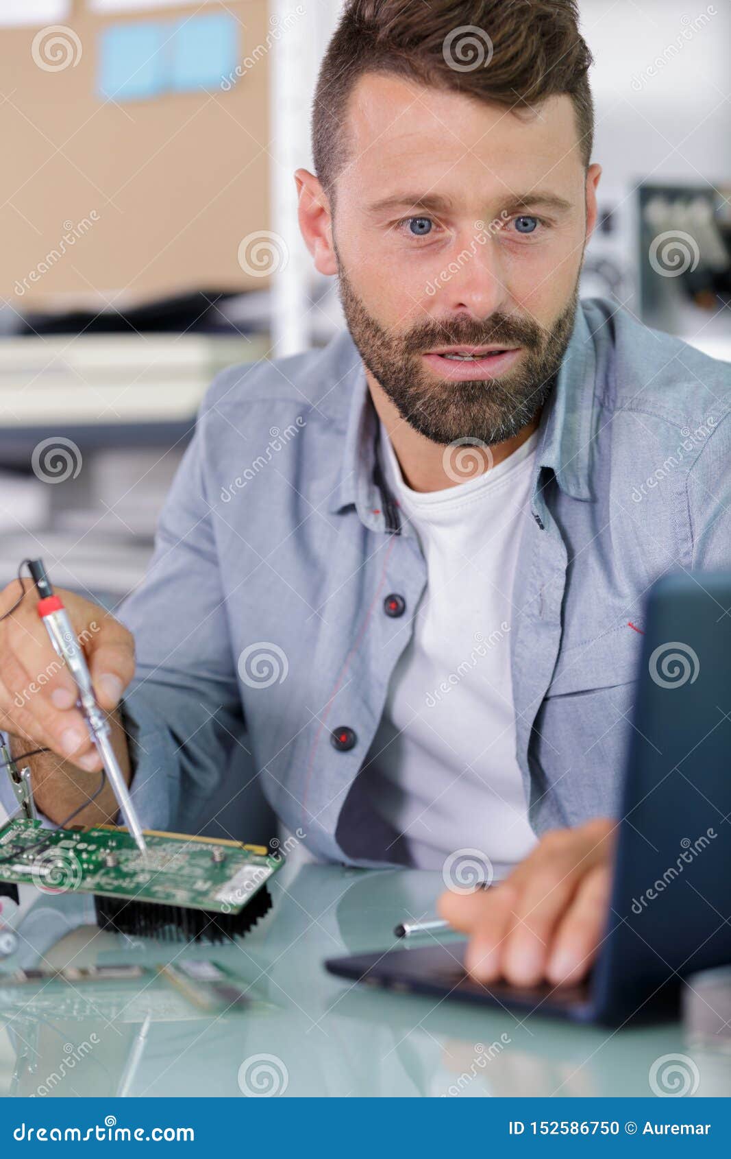 Technician Man Working on Laptop with Mockup Screen Stock Photo - Image ...