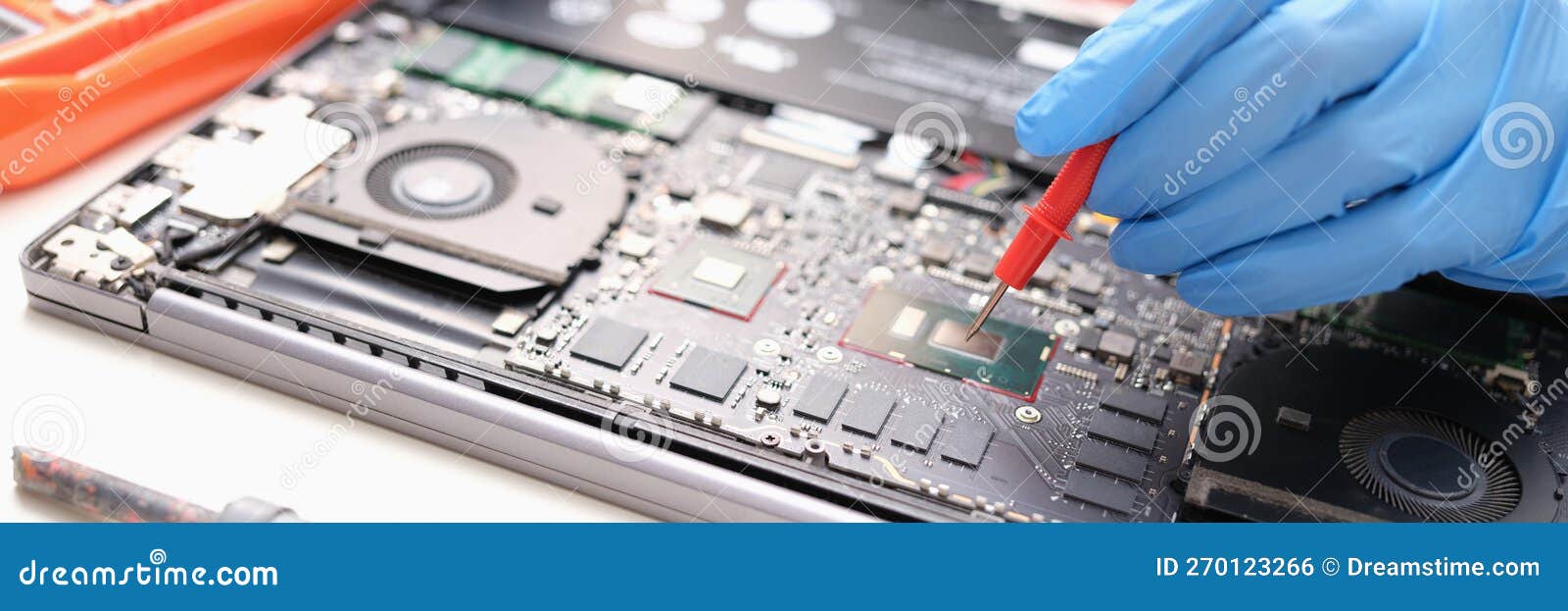 Technician Measures the Voltage on Motherboard of Computer Electronic ...