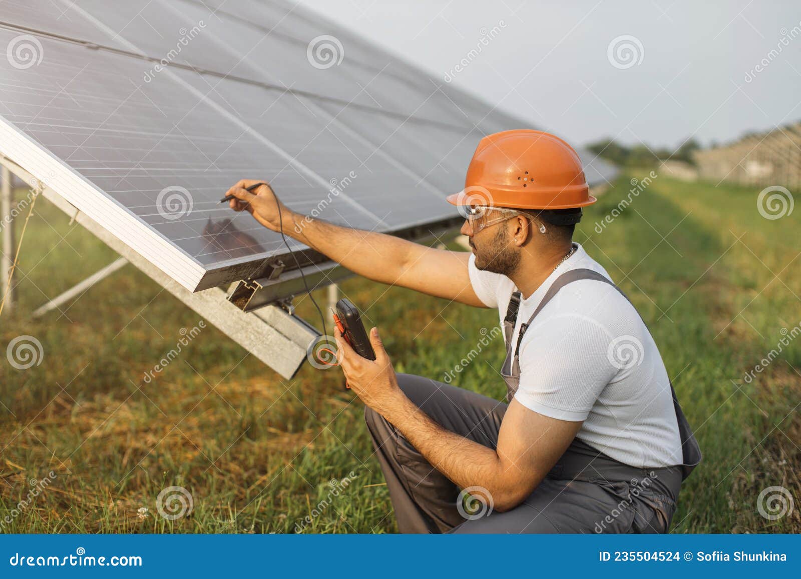 Technician Measuring Amperage of Solar Panels Stock Photo - Image of ...