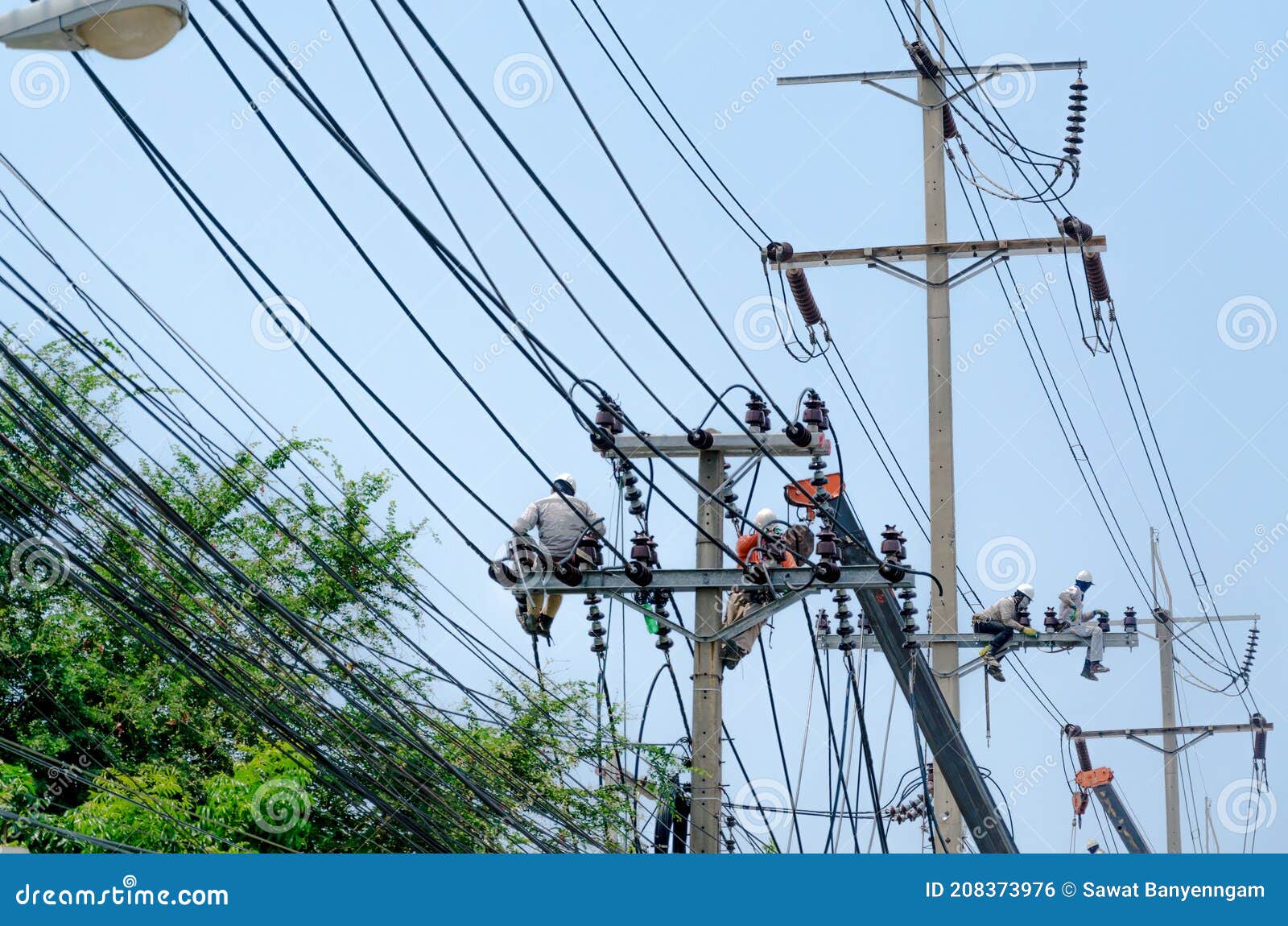 Technician Men Fixing or Repairing Broken Power Line on Electric Pole ...