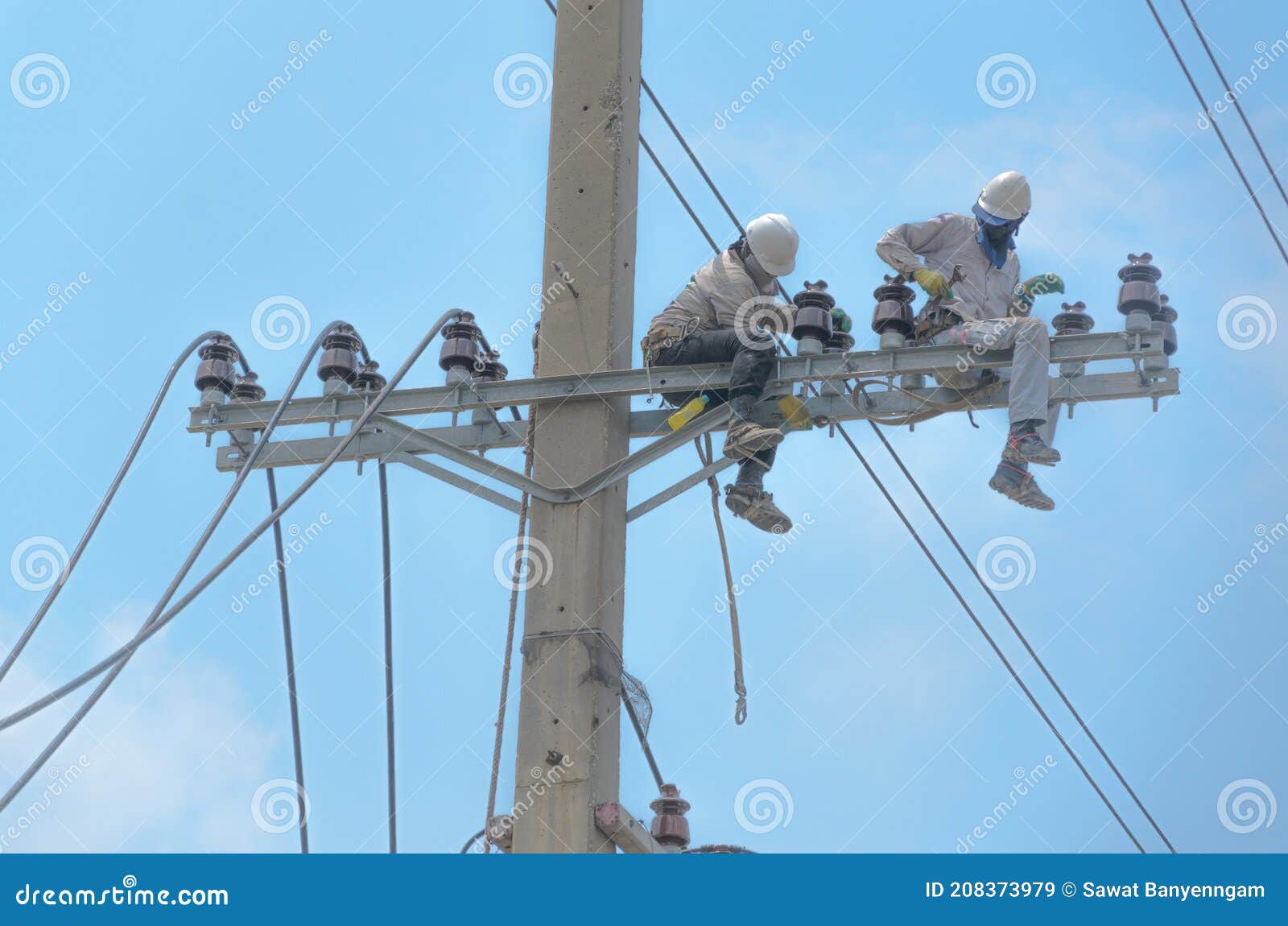 Technician Men Fixing or Repairing Broken Power Line on Electric Pole ...