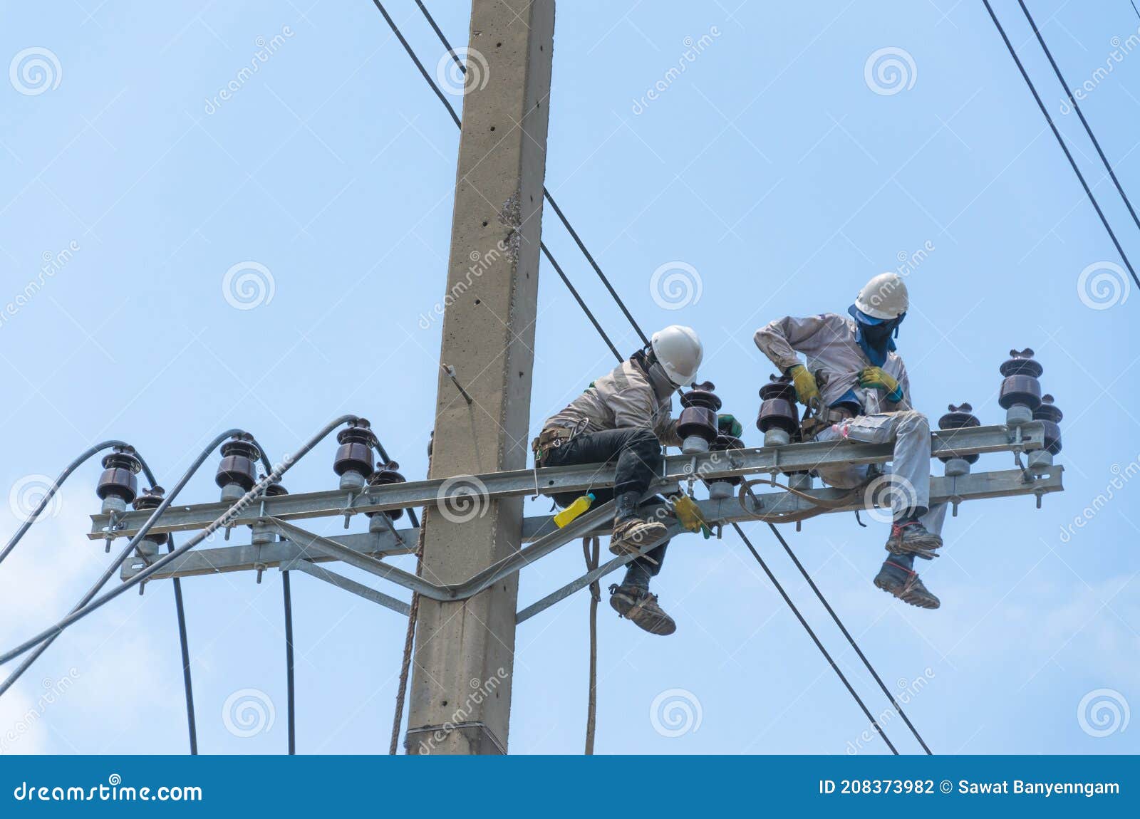 Technician Men Fixing or Repairing Broken Power Line on Electric Pole ...