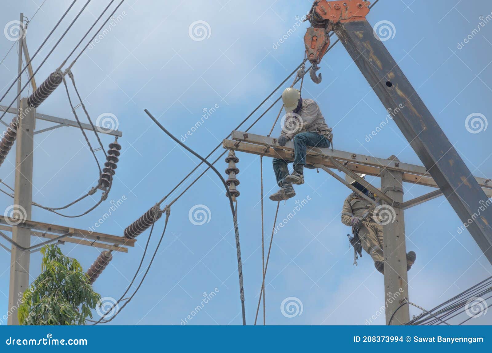 Technician Men Fixing or Repairing Broken Power Line on Electric Pole ...