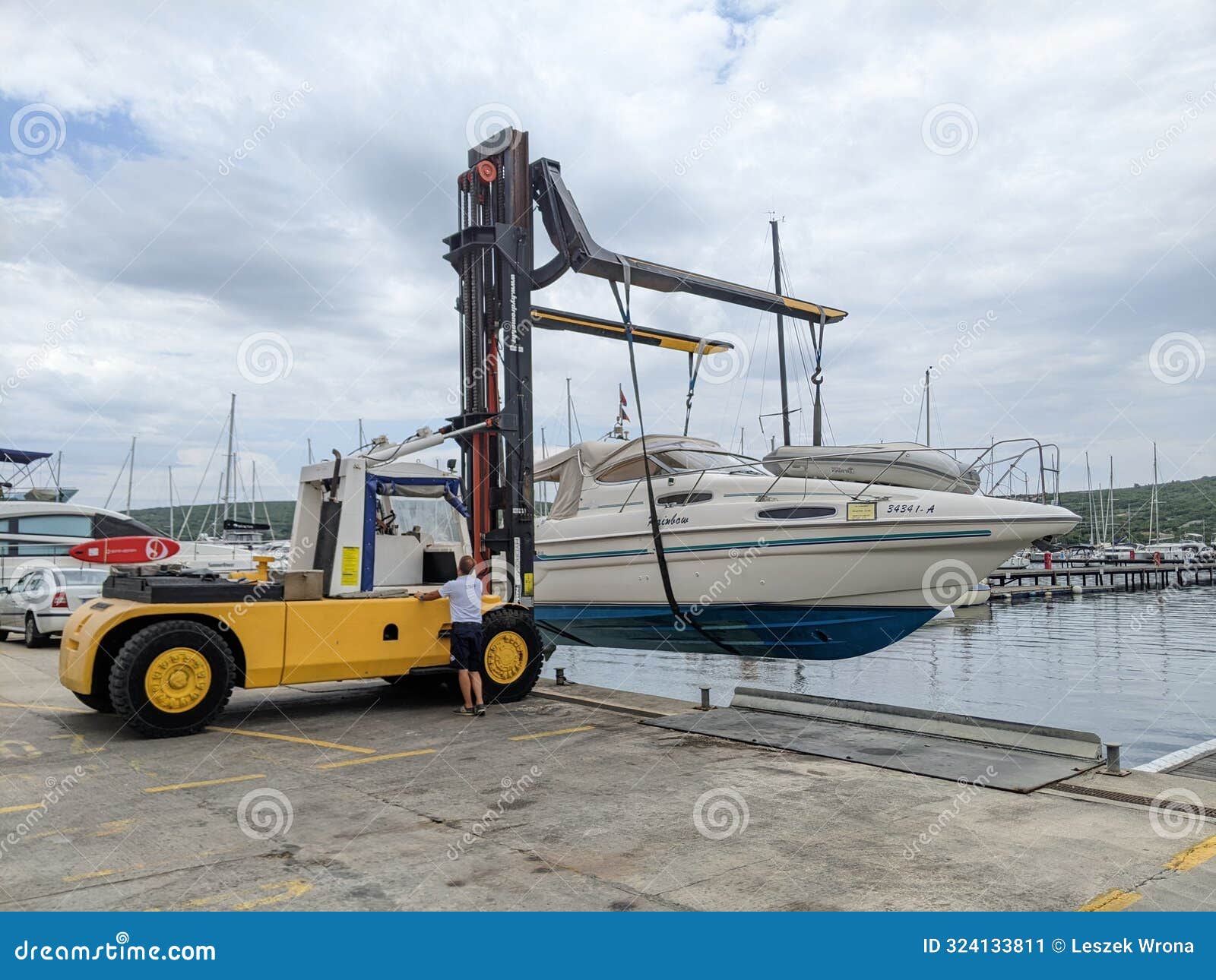 Technician Operates Marina Hoist Lifting a Boat Editorial Photo - Image ...