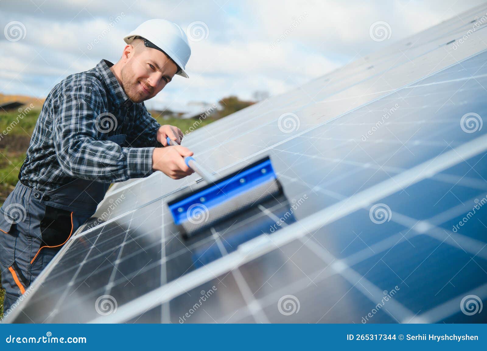 Technician Operating and Cleaning Solar Panels at Generating Power of ... Technician Operating and Cleaning Solar Panels at Generating Power of ...