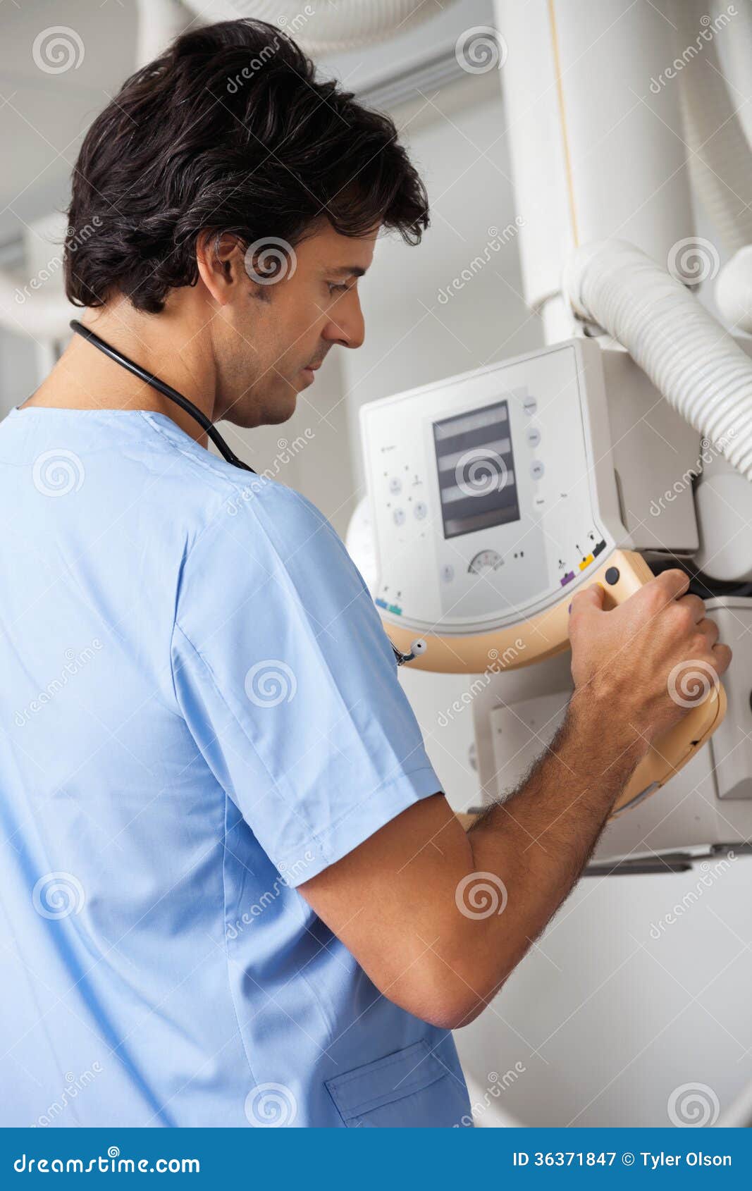 Technician Operating X-ray Machine Stock Image - Image of practitioner ...
