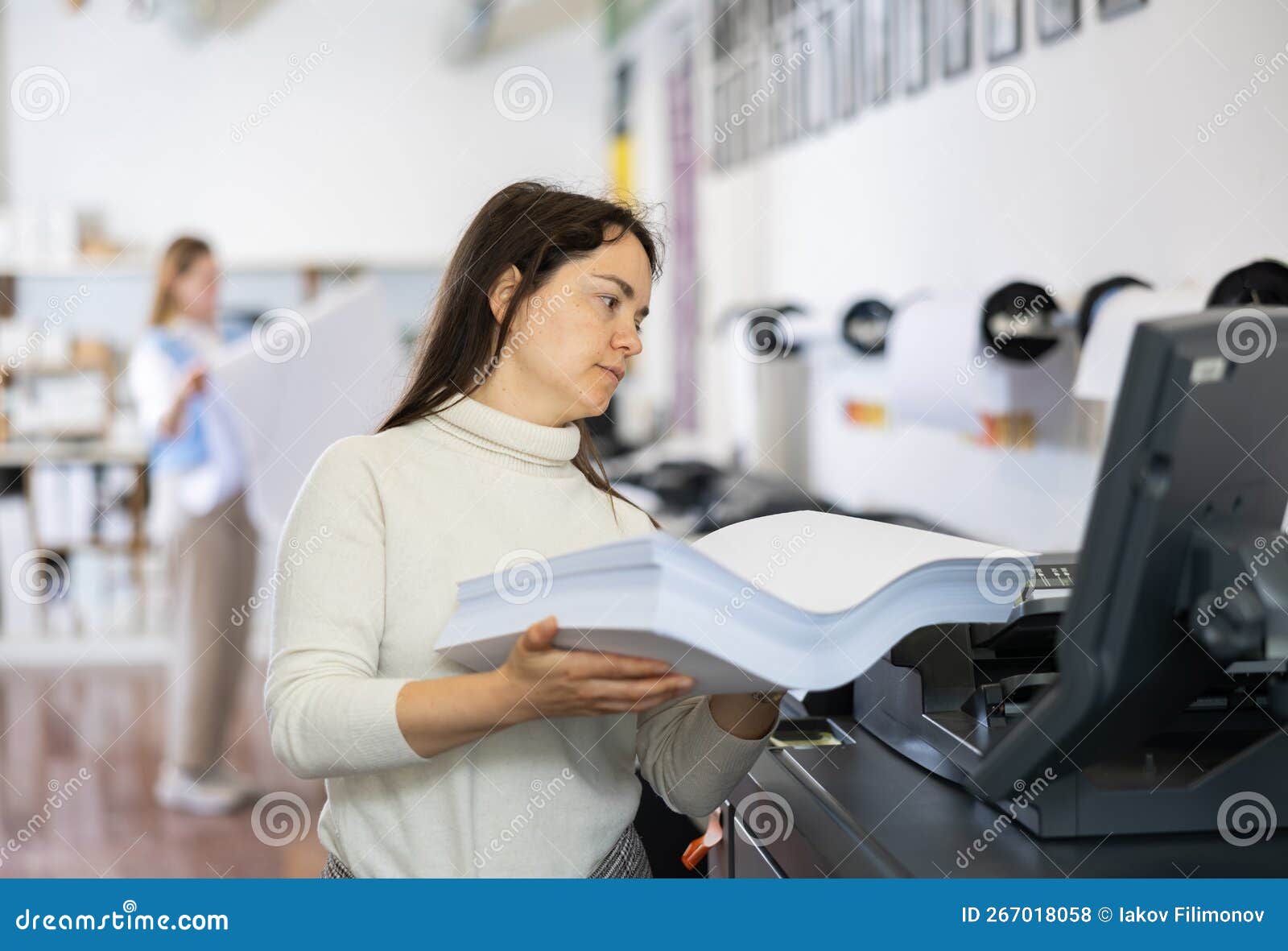 Technician Operator Changes Paper on Printer Plotter Machine Stock ... Technician Operator Changes Paper on Printer Plotter Machine Stock ...