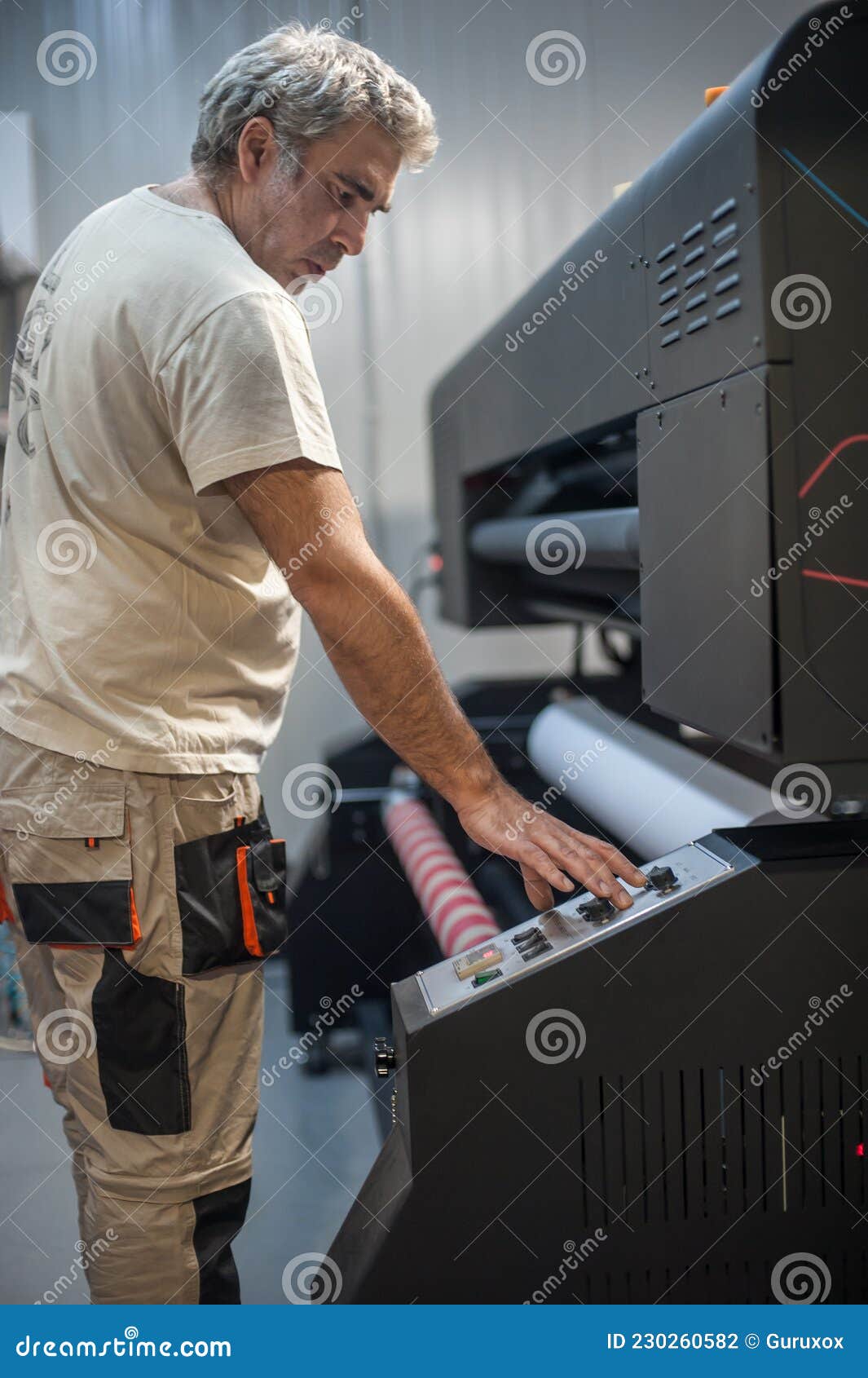 Technician Operator Changes Paper Roll on Large Printer Plotter Machine ... Technician Operator Changes Paper Roll on Large Printer Plotter Machine ...