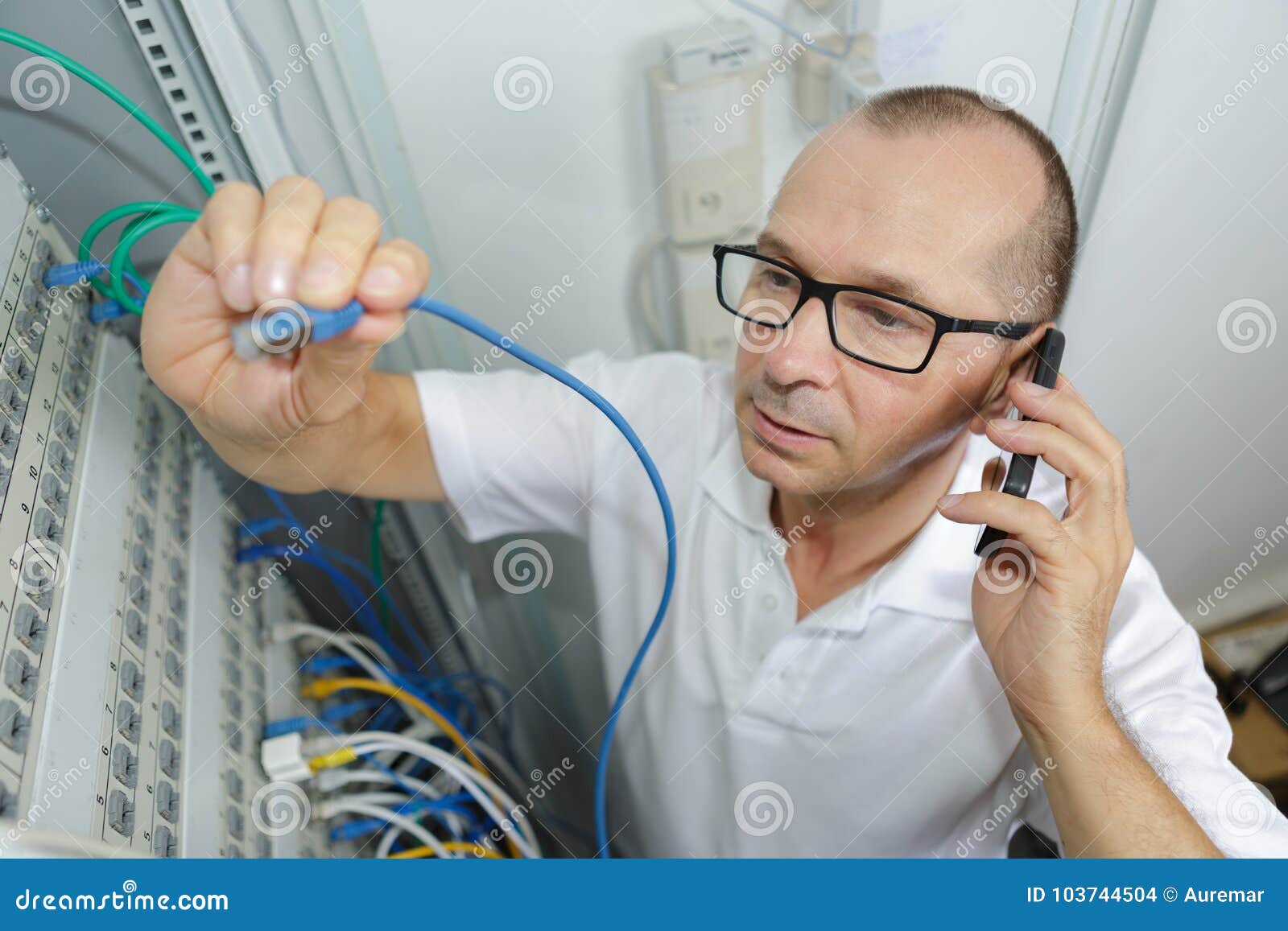 Technician on Phone in Server Room Stock Photo - Image of mounted, rack ...