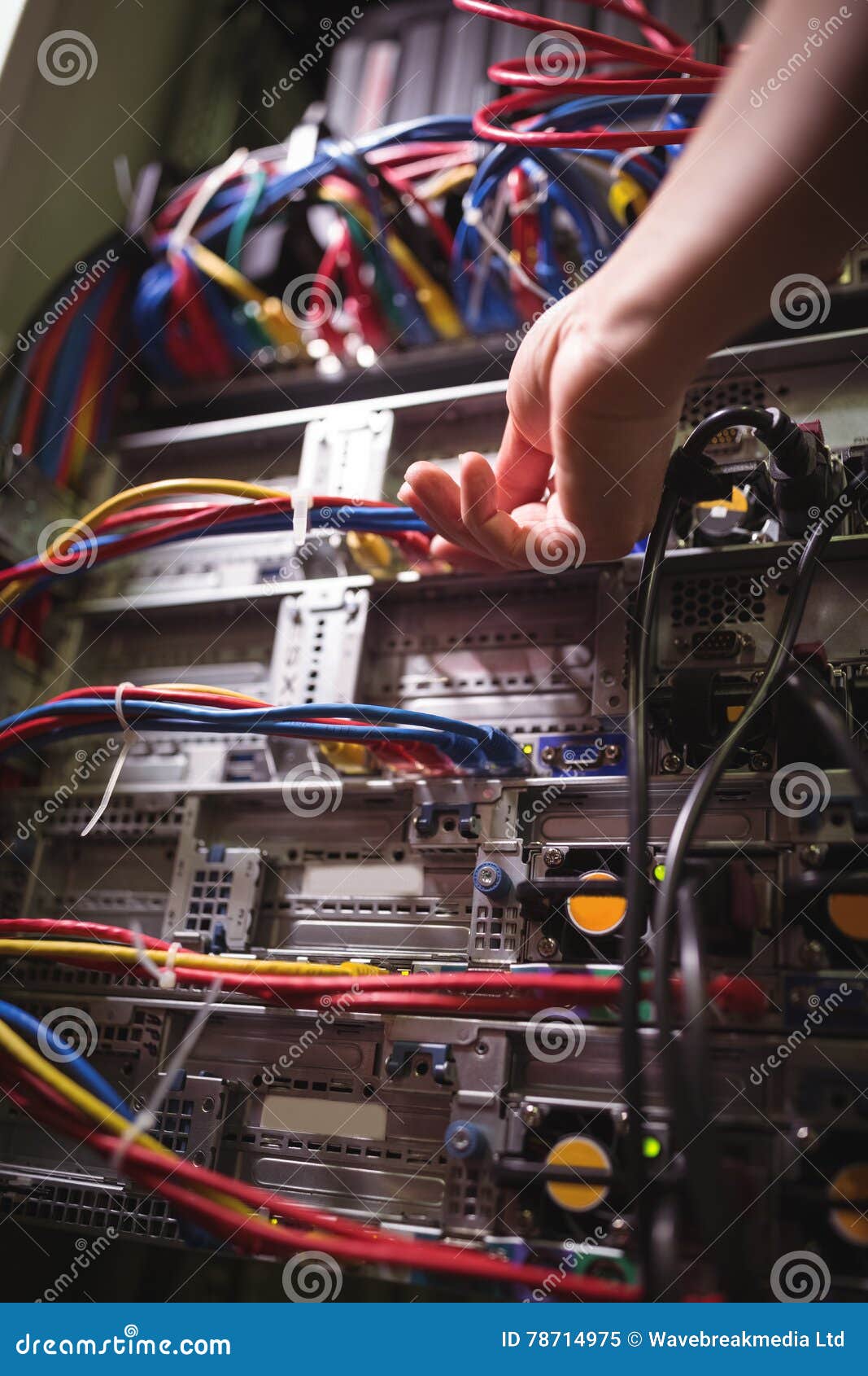 Technician Plugging Patch Cable in a Rack Mounted Server Stock Image ...