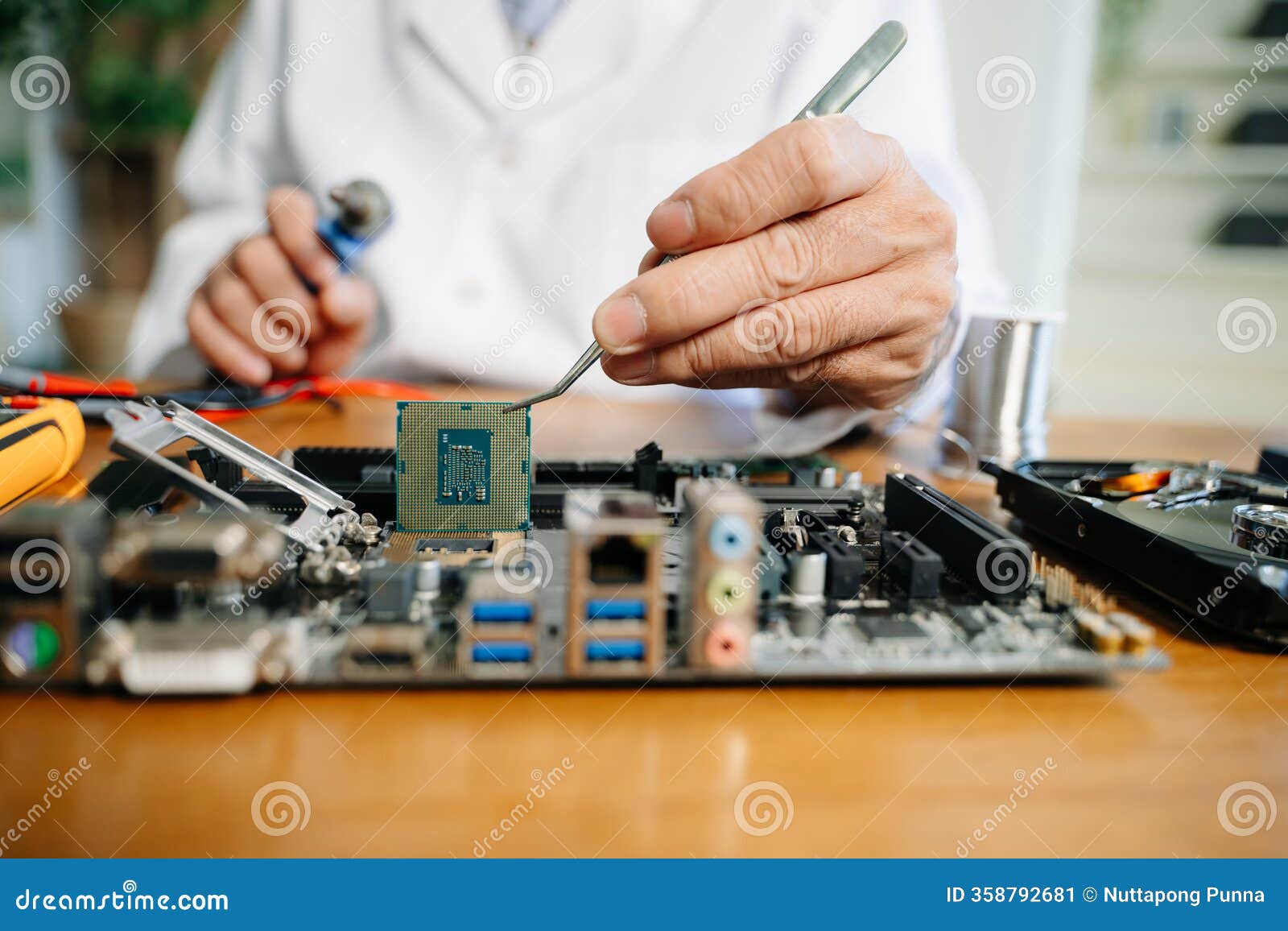 The Technician is Putting the CPU on the Socket of the Computer ...